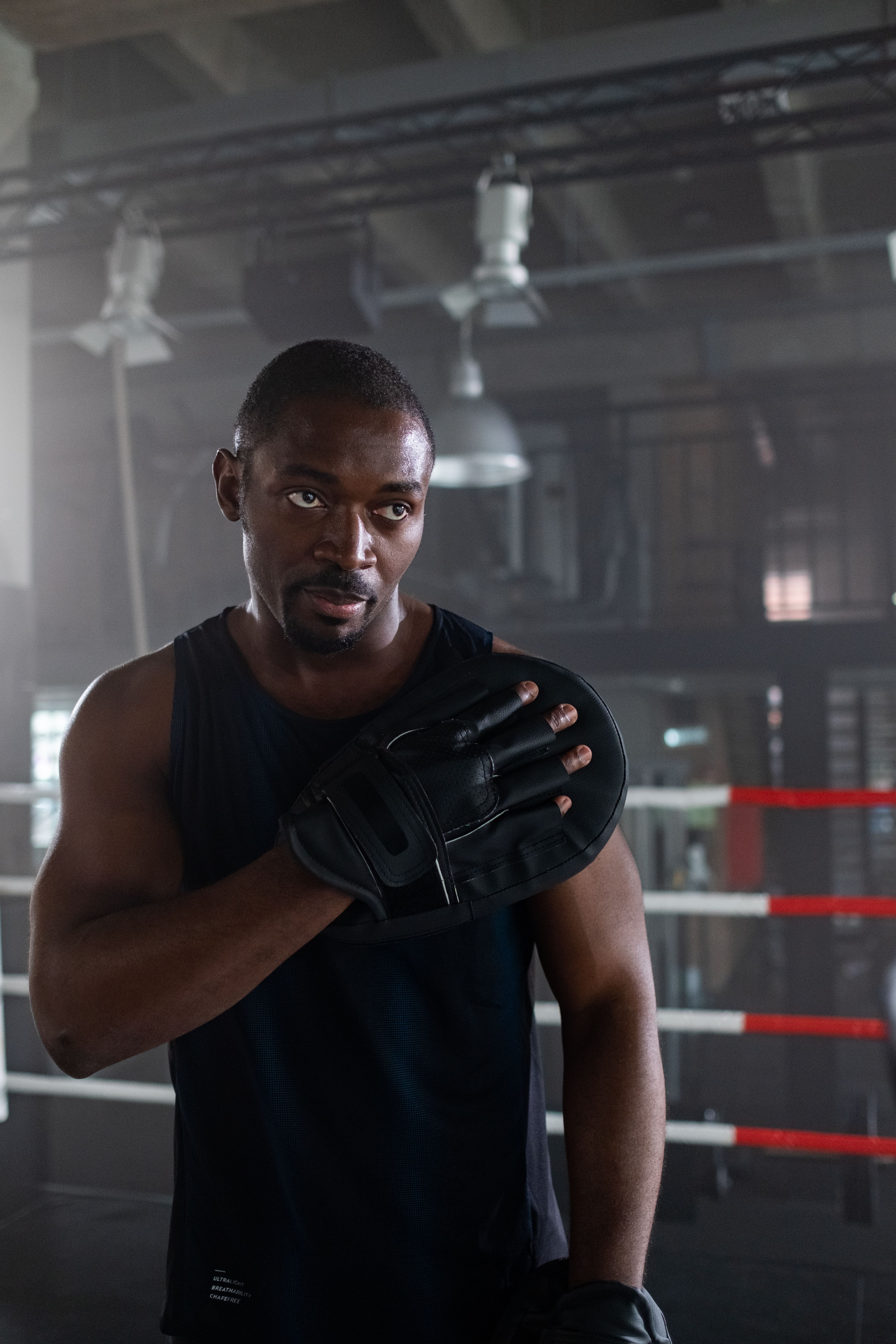 Man in Black Tank Top With Boxing Pad · Free Stock Photo