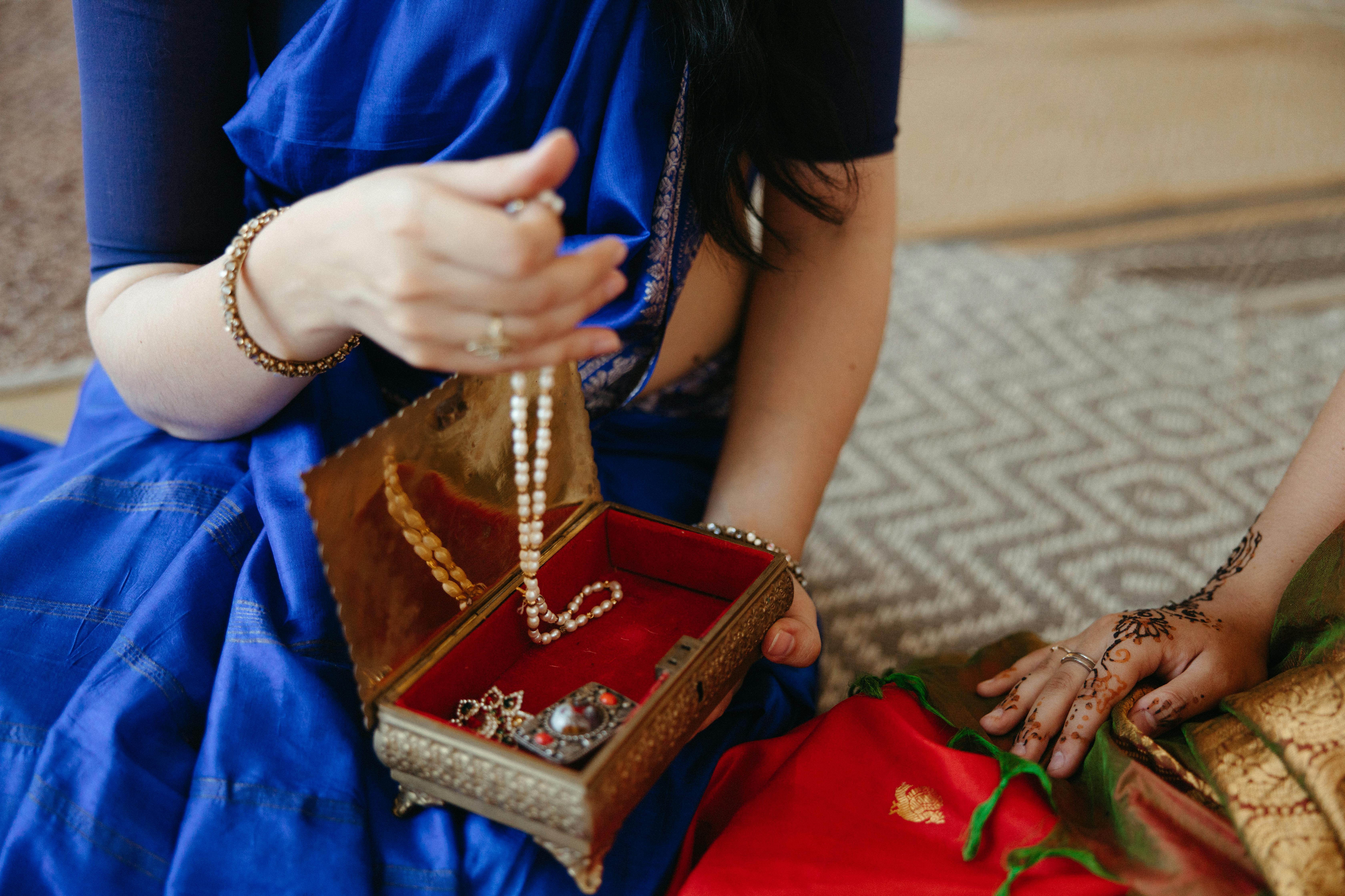 Woman Holding a Jewelry Box · Free Stock Photo