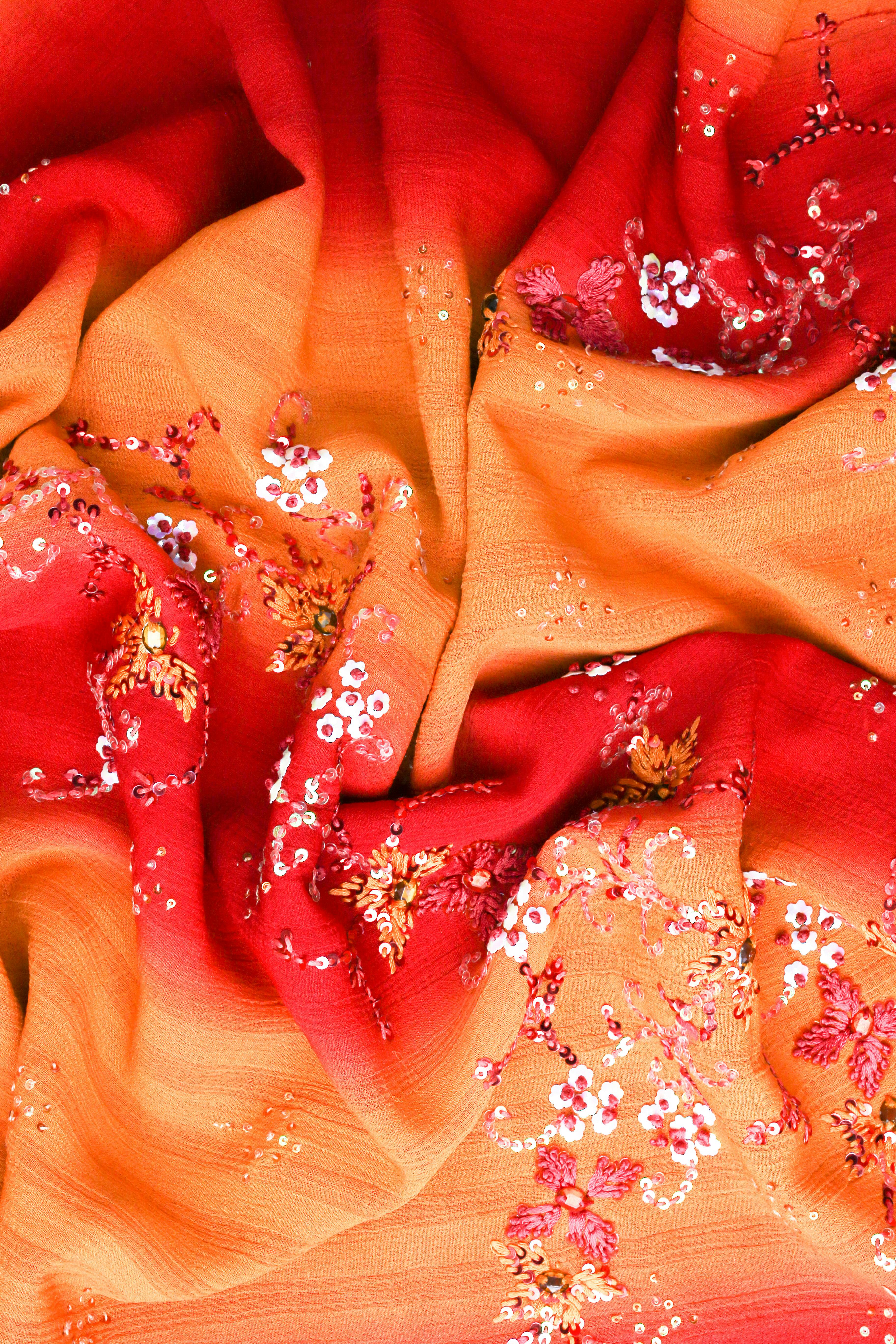 Embroidery Design on Orange Fabric · Free Stock Photo