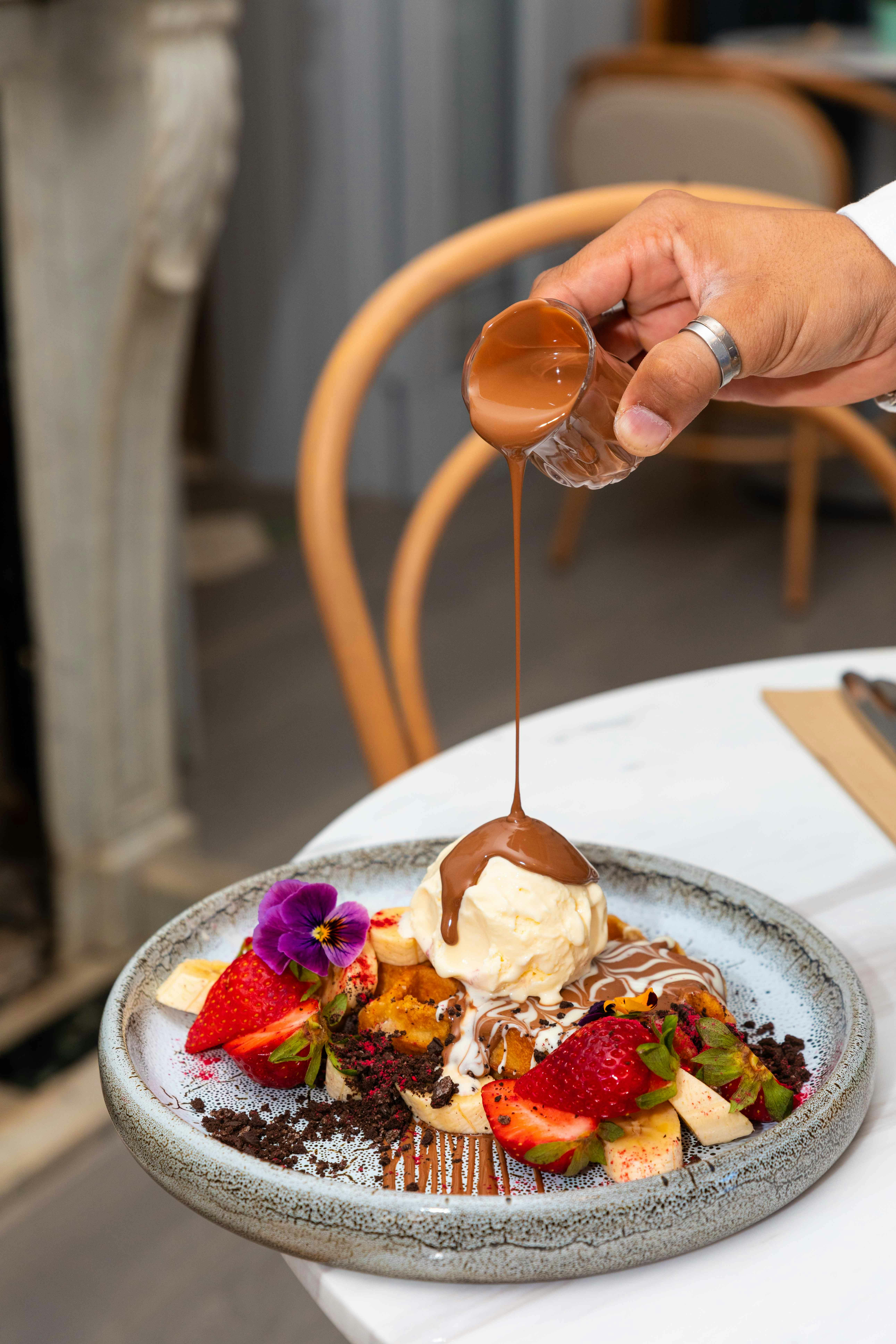 Close Up of Hand Holding Food on Feast · Free Stock Photo