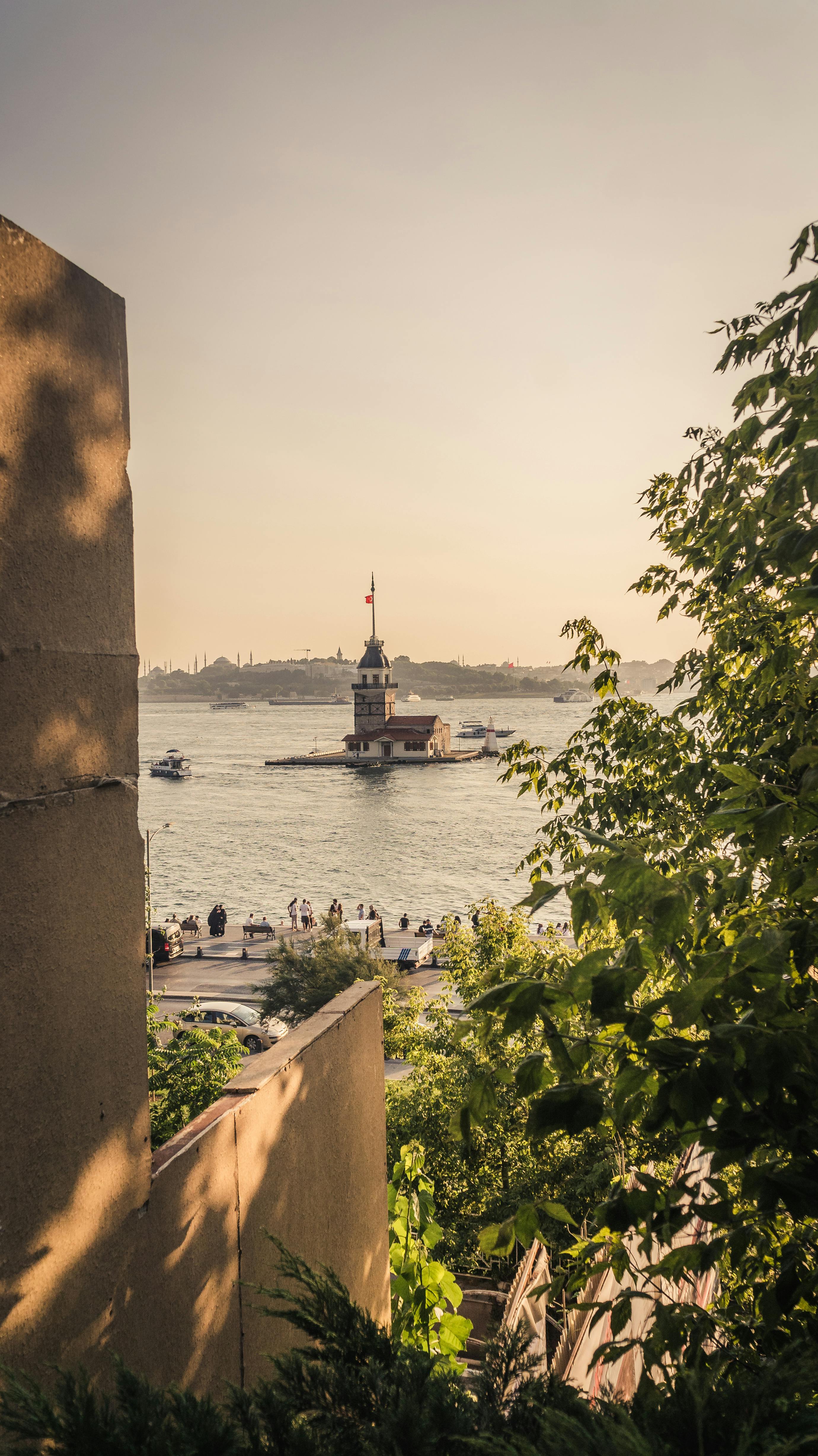 Brown High Rise Building Surrounded by People · Free Stock Photo