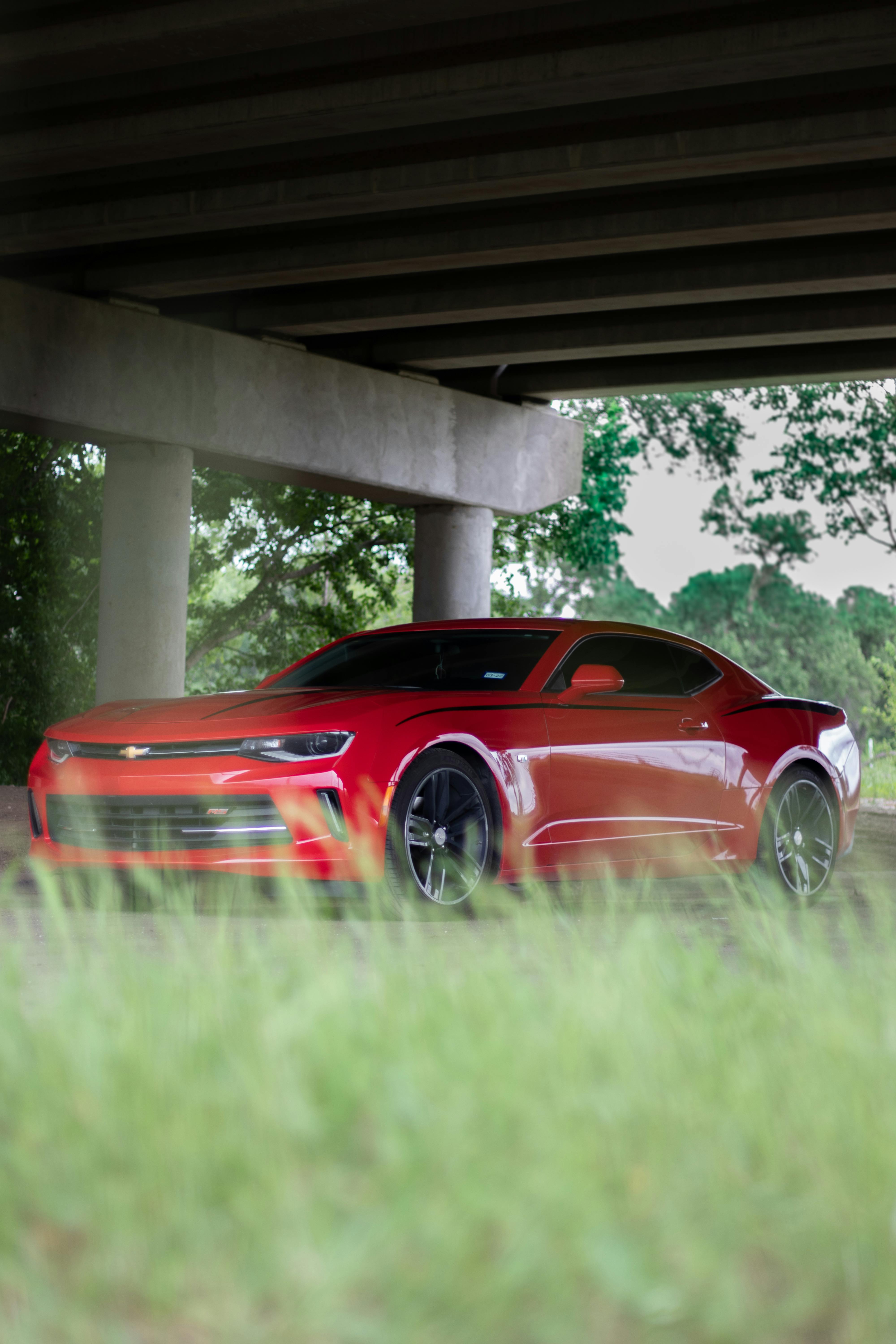 Red Car Parked Under the Bridge · Free Stock Photo