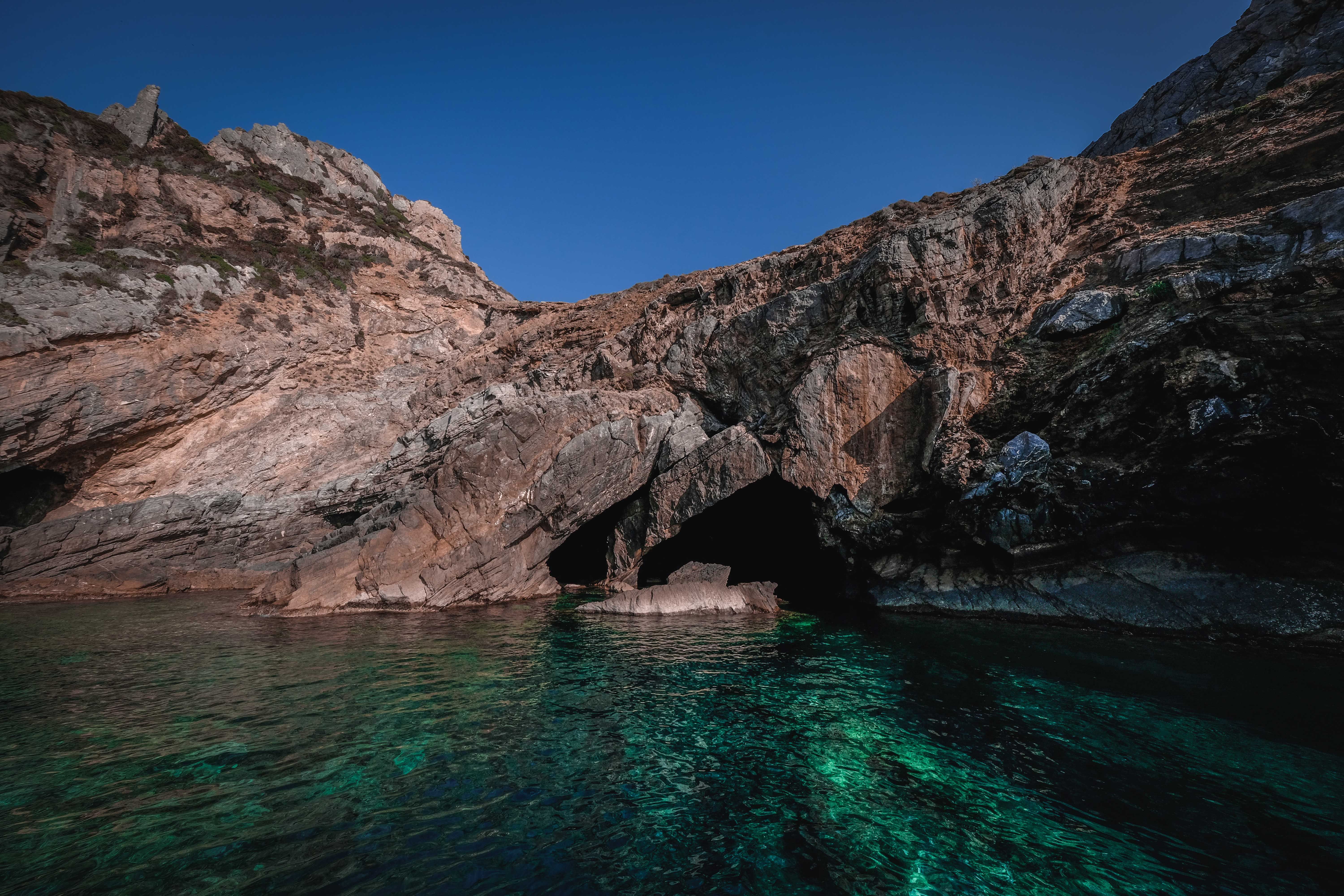 A Brown Cave on Water · Free Stock Photo