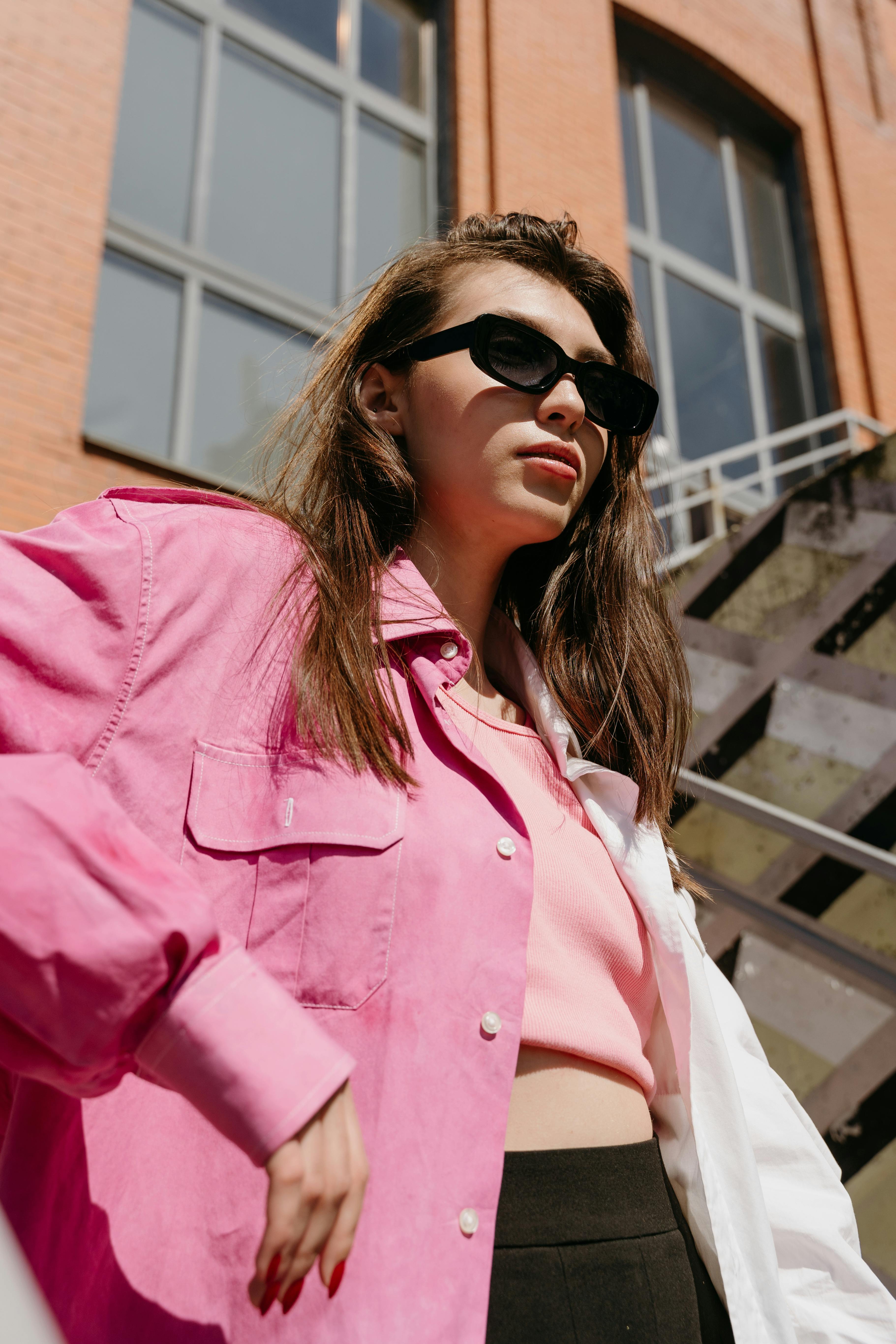 Woman in Pink Button Up Jacket Wearing Black Sunglasses · Free Stock Photo
