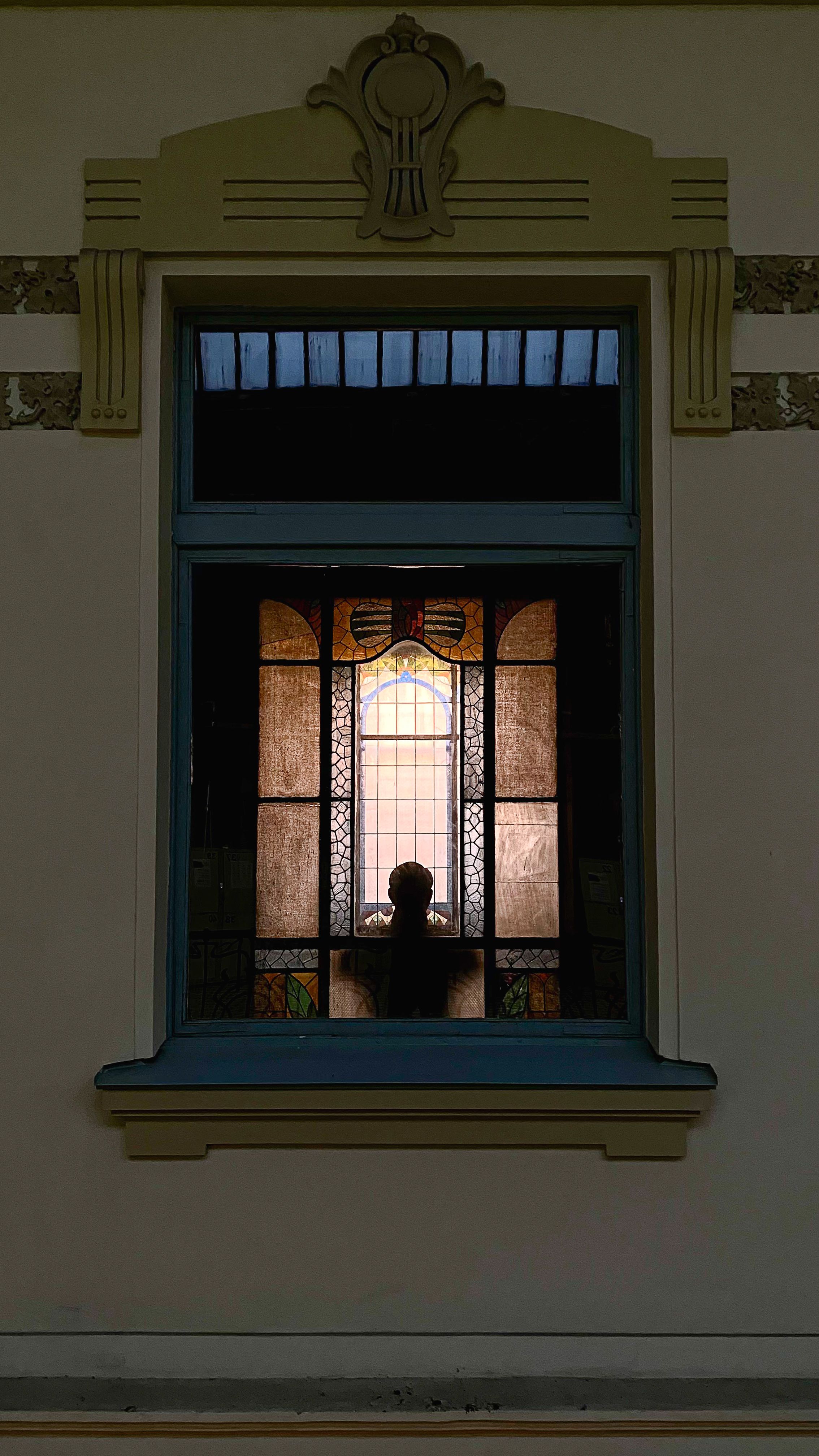 A Person Standing Behind Wooden Window with Stained Glass · Free Stock ...