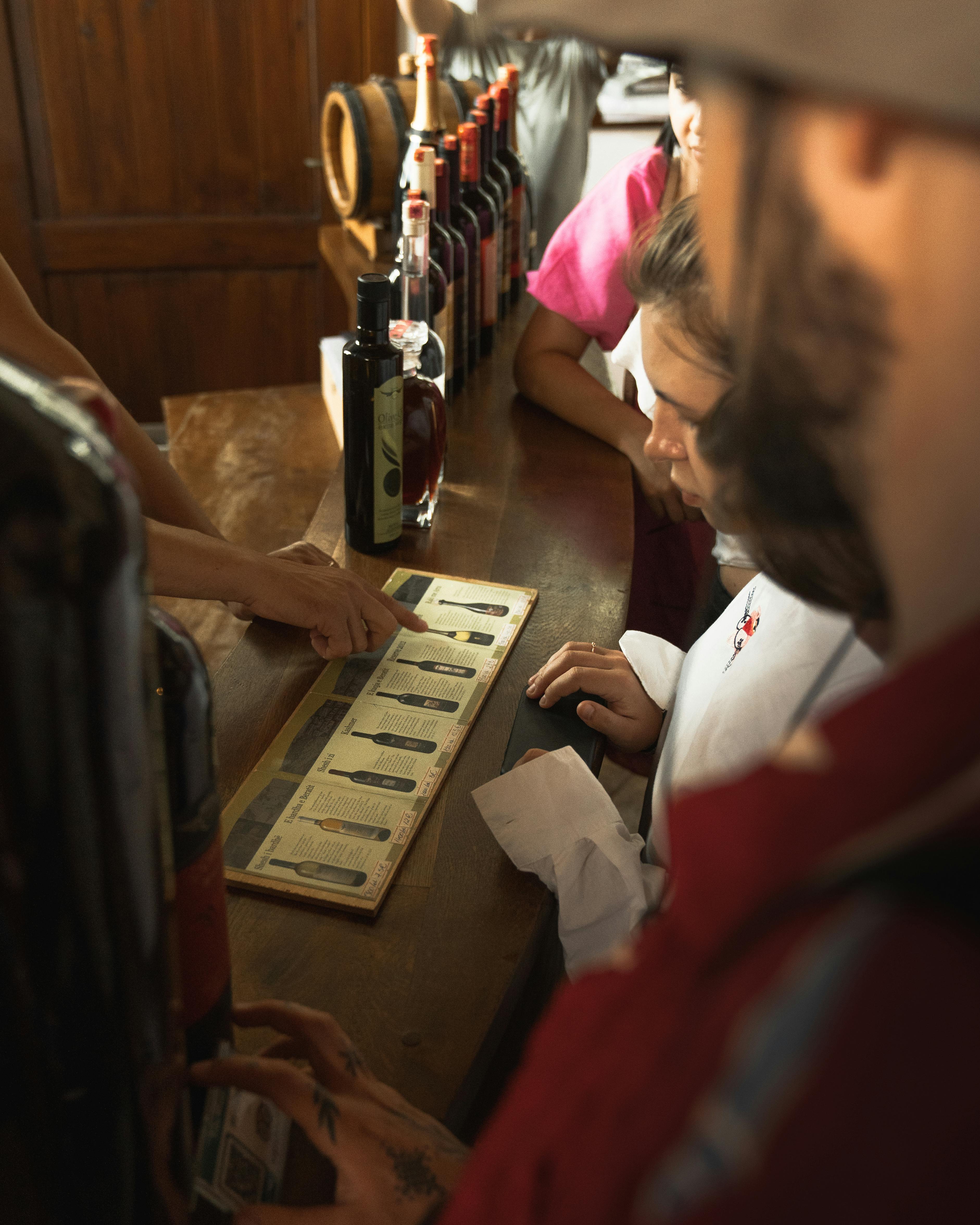 Customers pointing in a Menu · Free Stock Photo