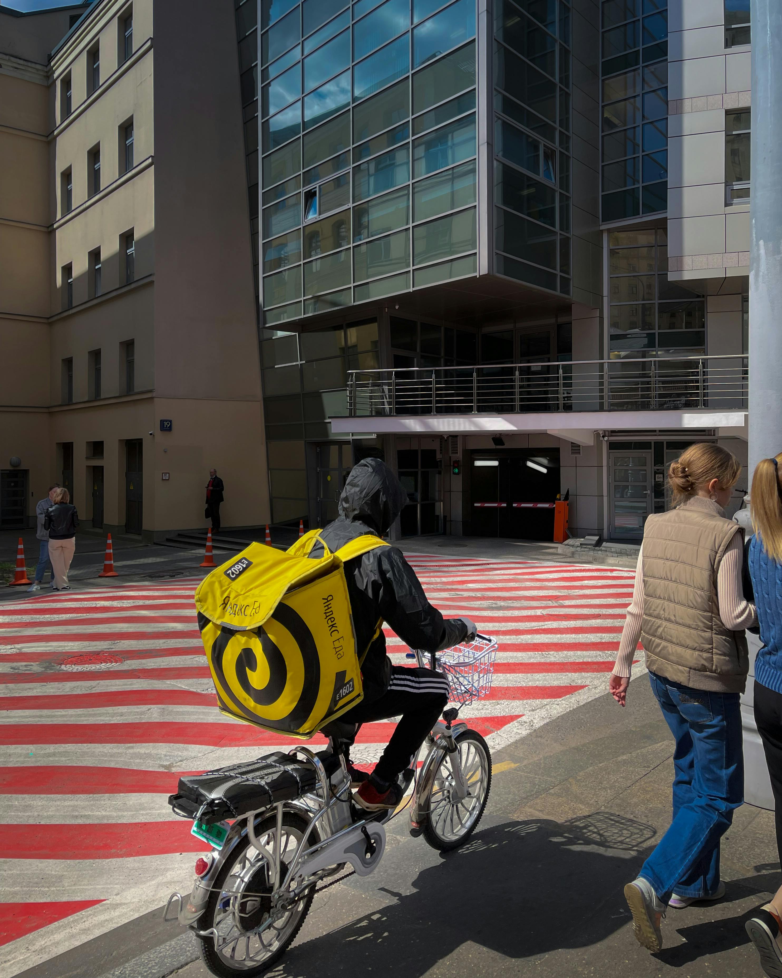 A Delivery Man Riding a Bicycle · Free Stock Photo