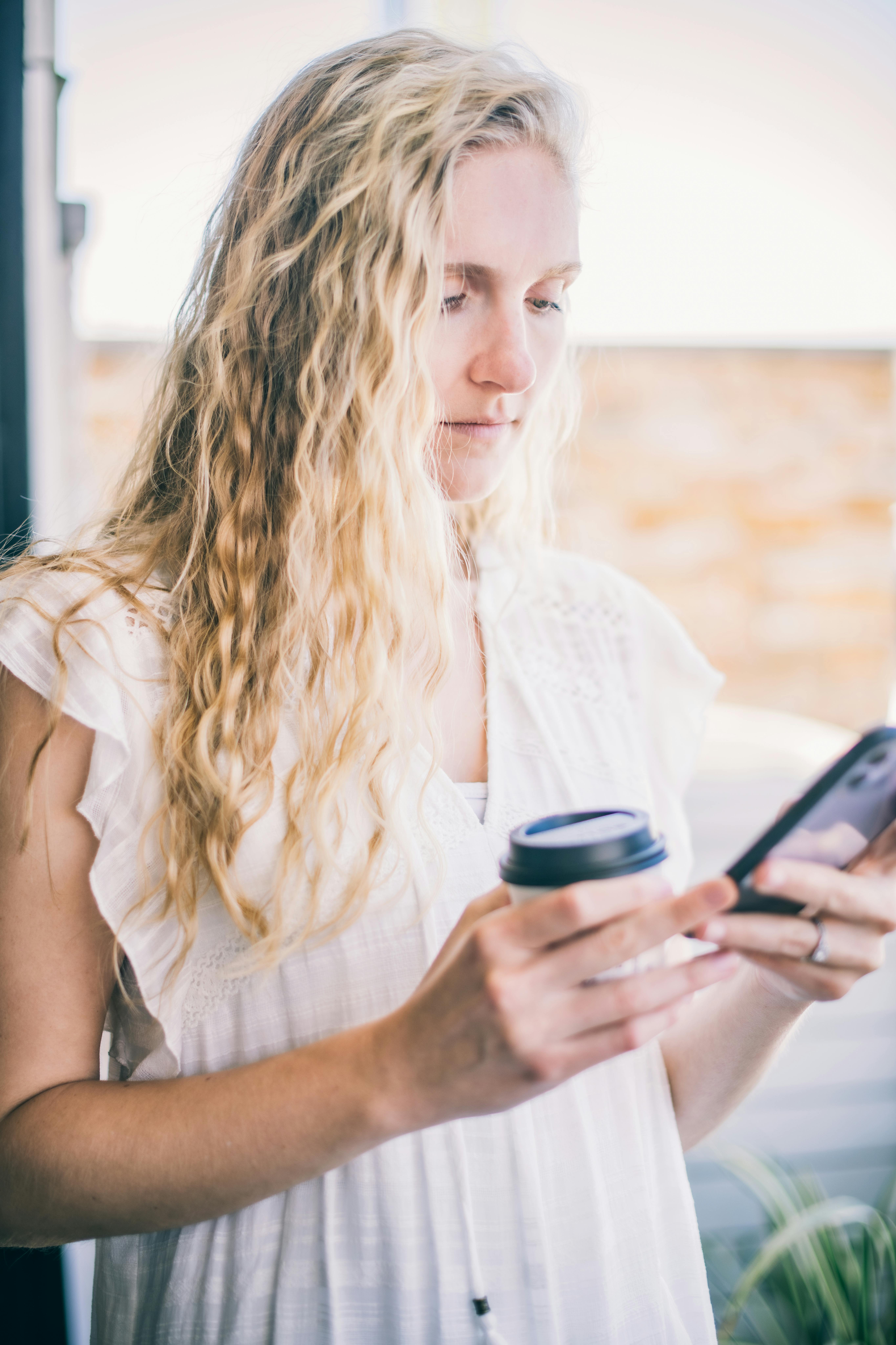 A Peron Using a Smartphone · Free Stock Photo