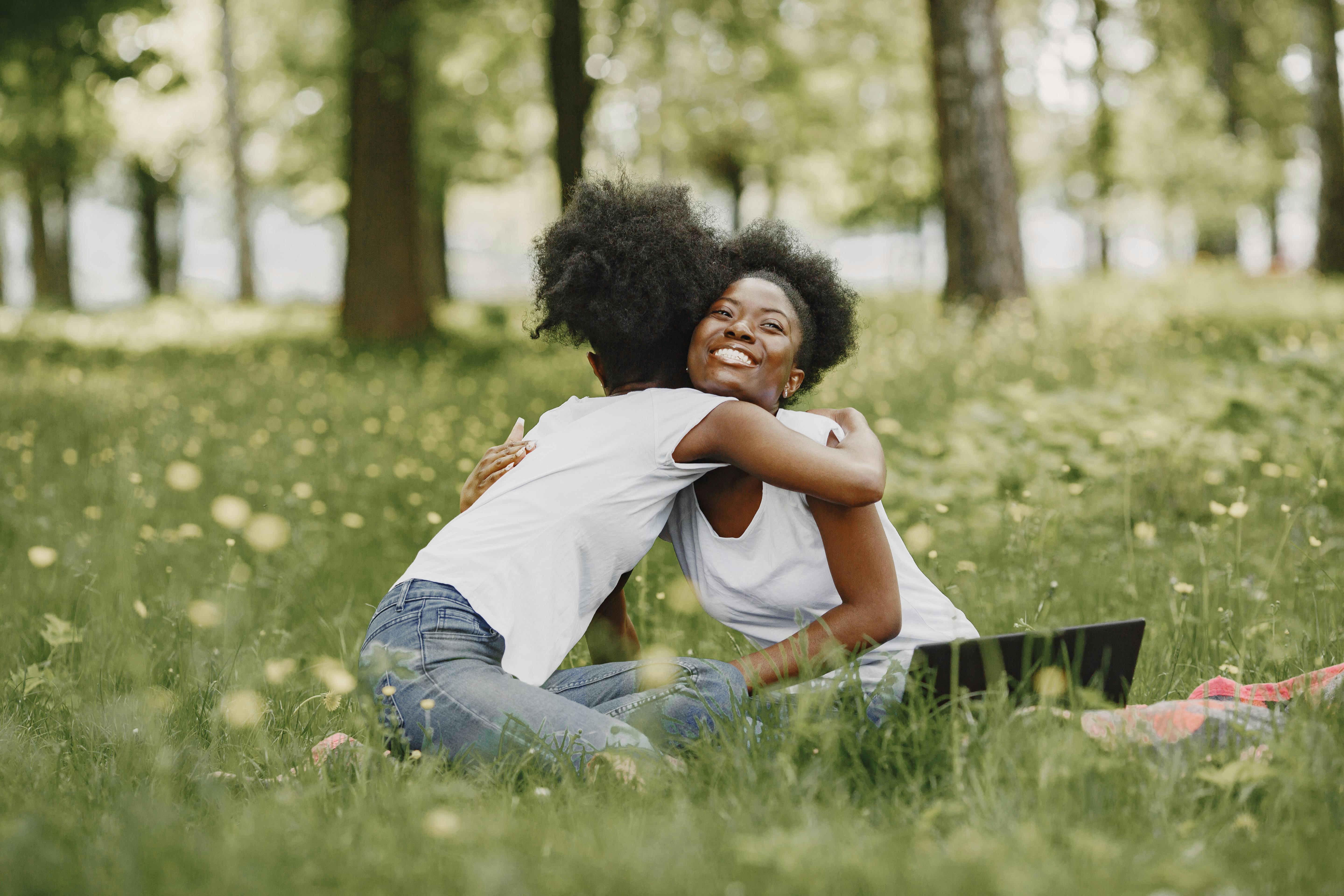 Women Sitting Together and Hugging · Free Stock Photo