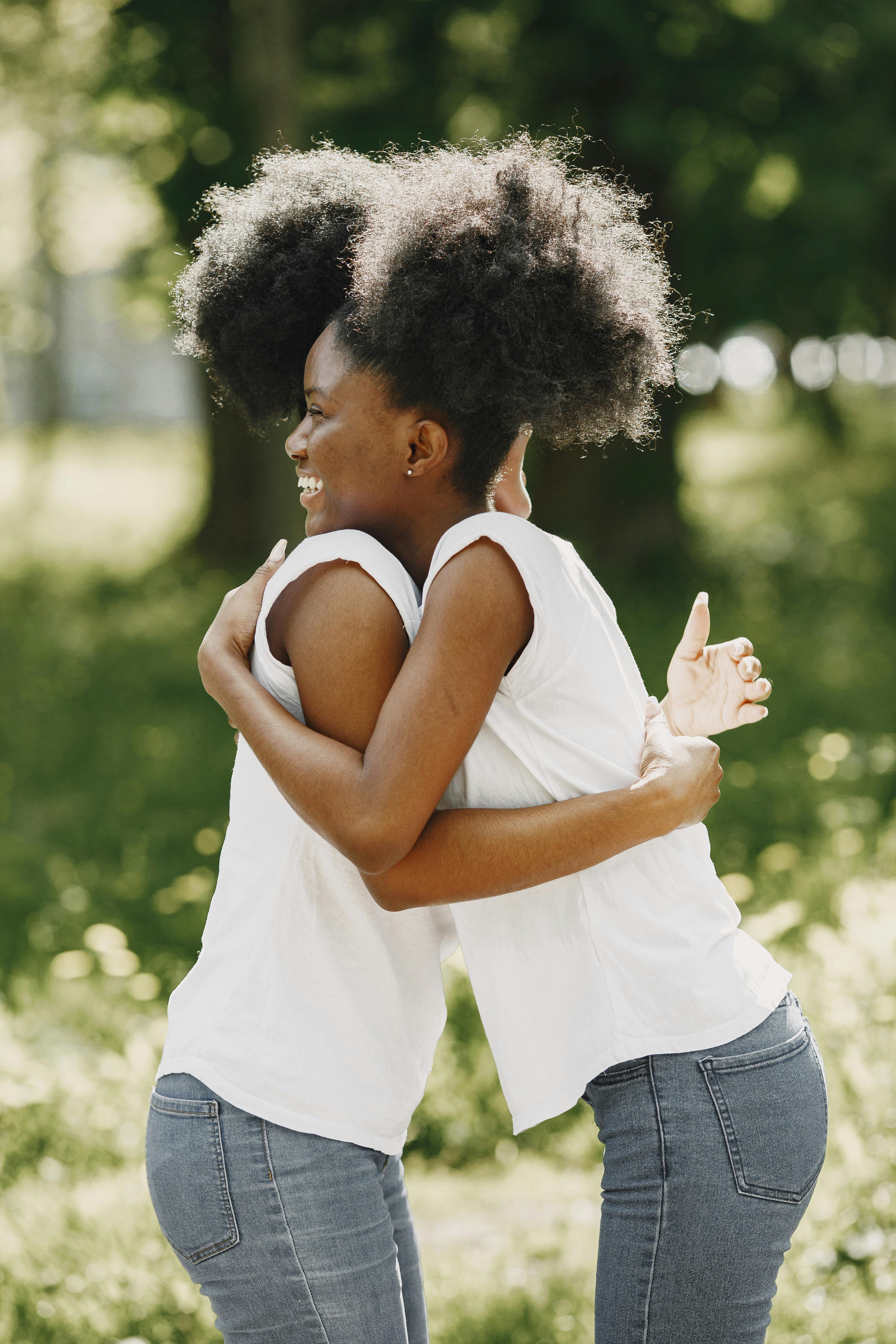 Women Wearing White Tank Tops Hugging · Free Stock Photo