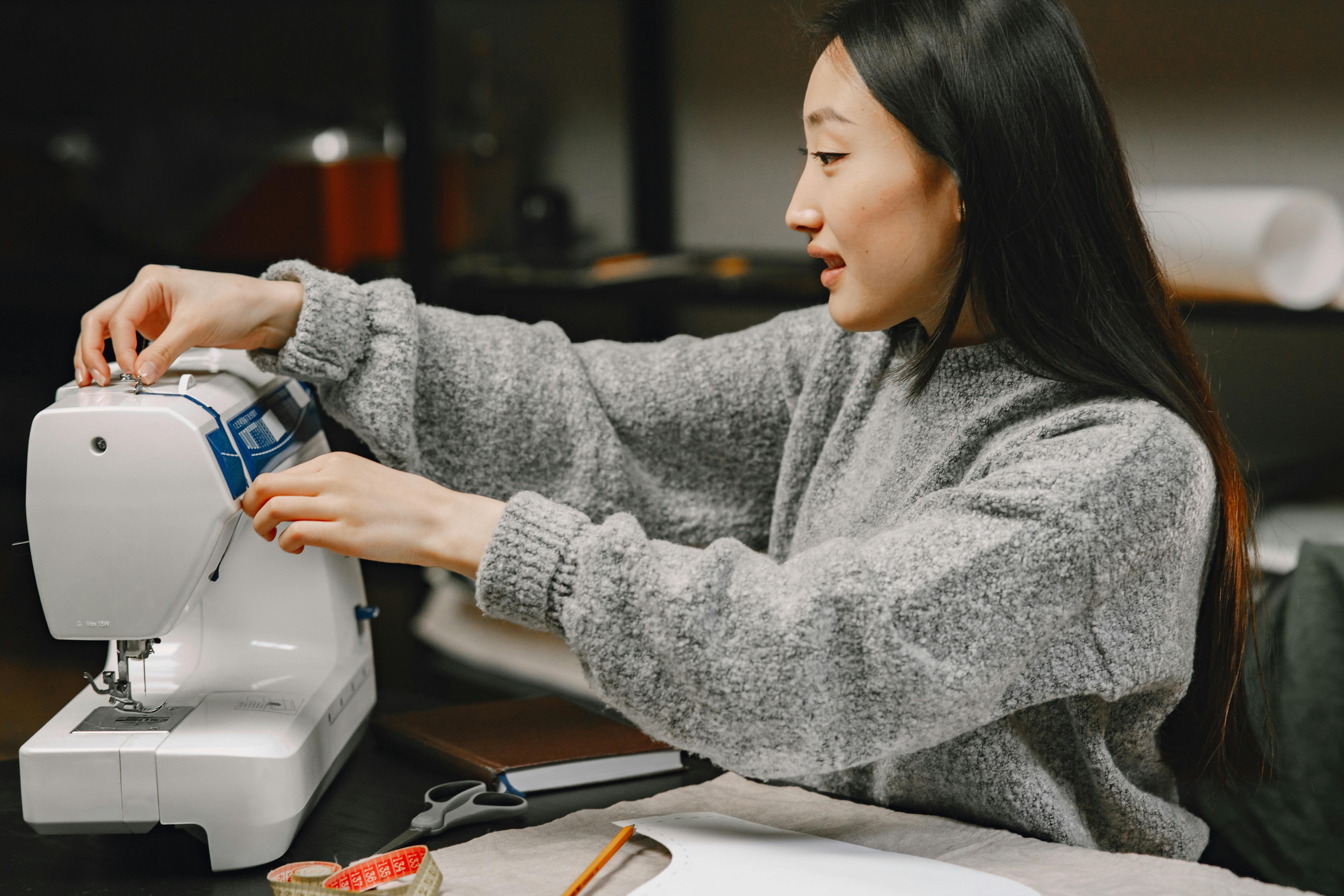Woman Setting up Sewing Machine · Free Stock Photo
