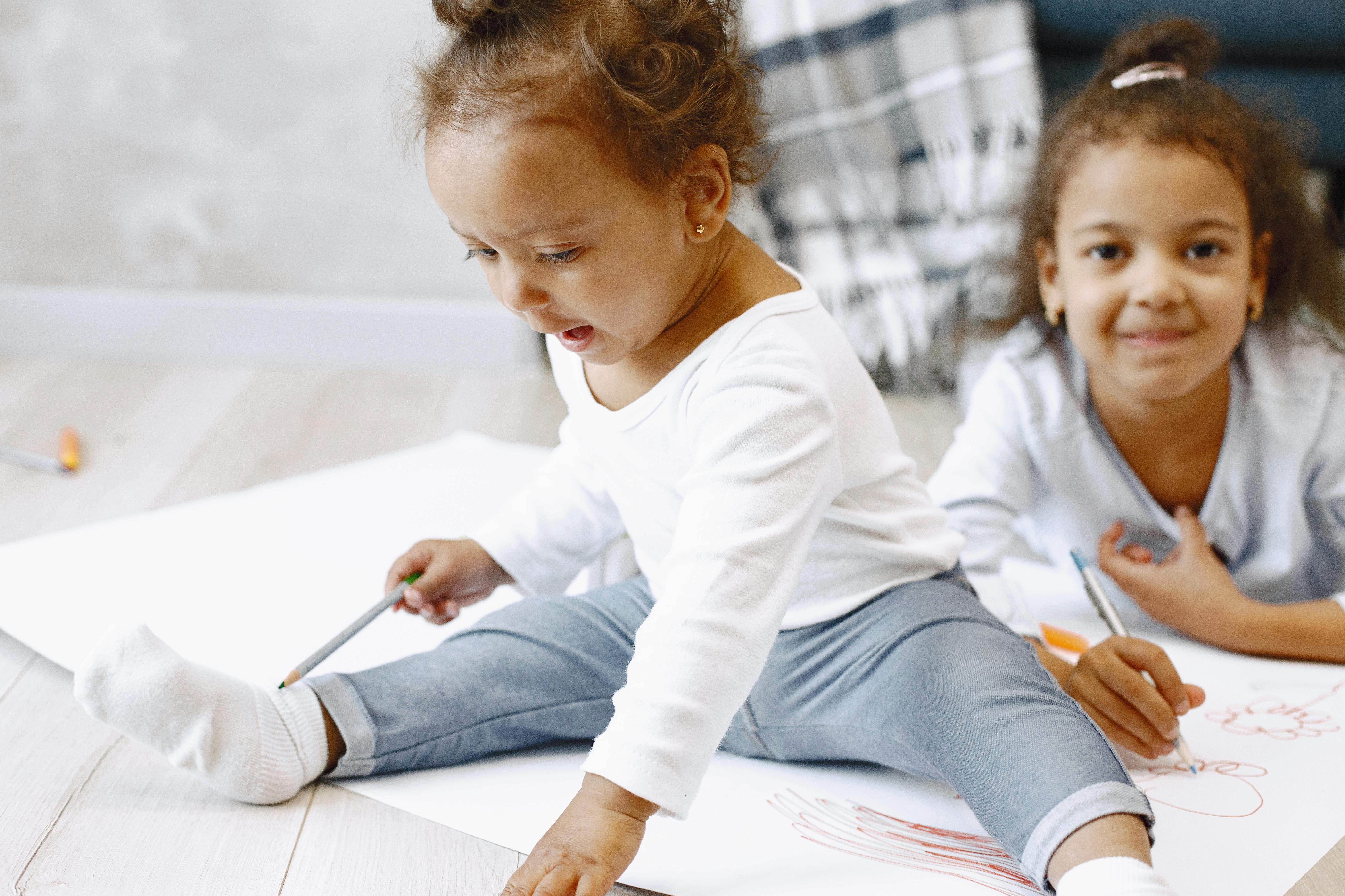 Children Sitting on Floor Playing · Free Stock Photo