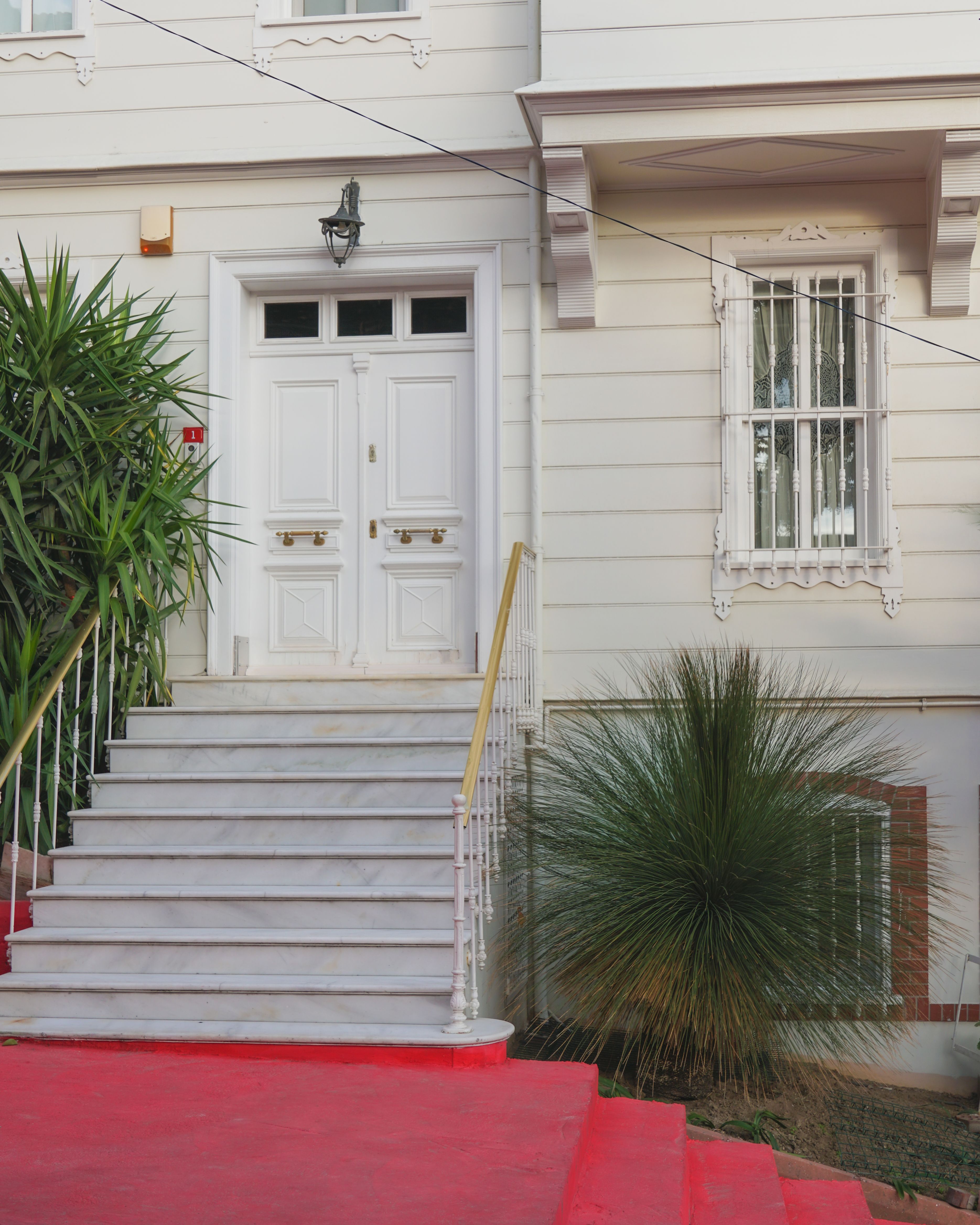 Steps and the Front Door of an Apartment Building · Free Stock Photo