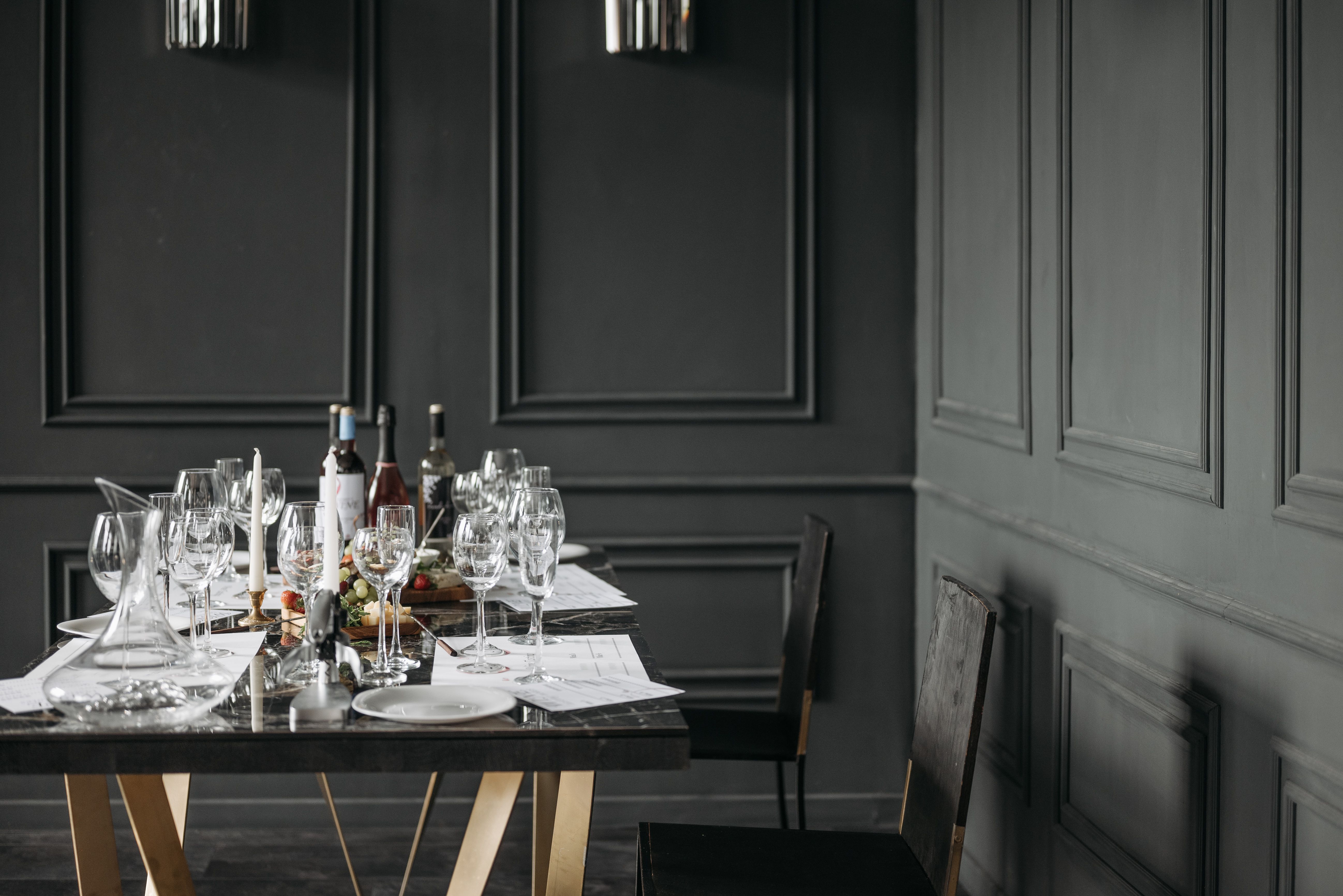 A Table with Wine Glasses and Wine Bottles · Free Stock Photo