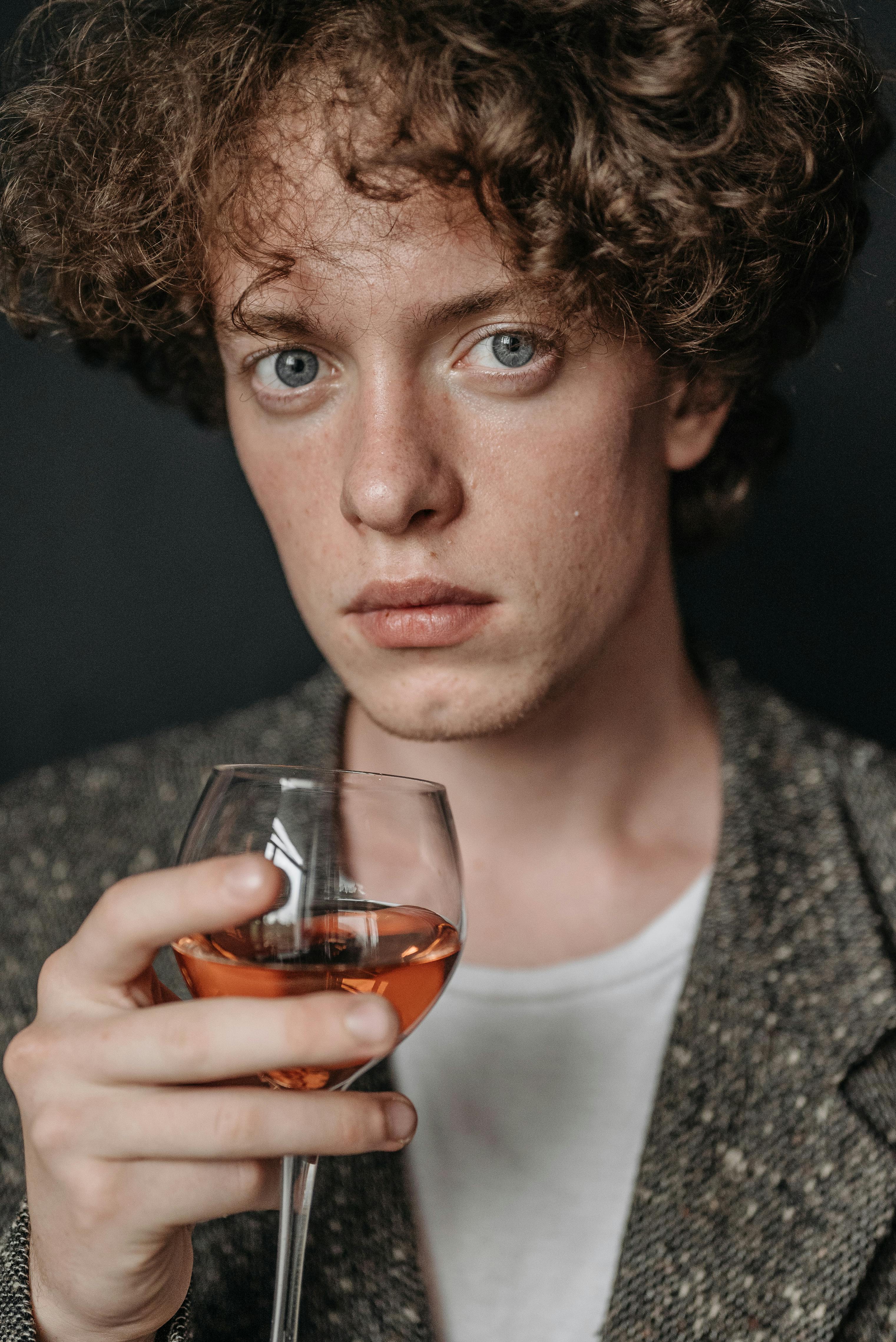 Gray Eyed Man Holding a Wine Glass · Free Stock Photo