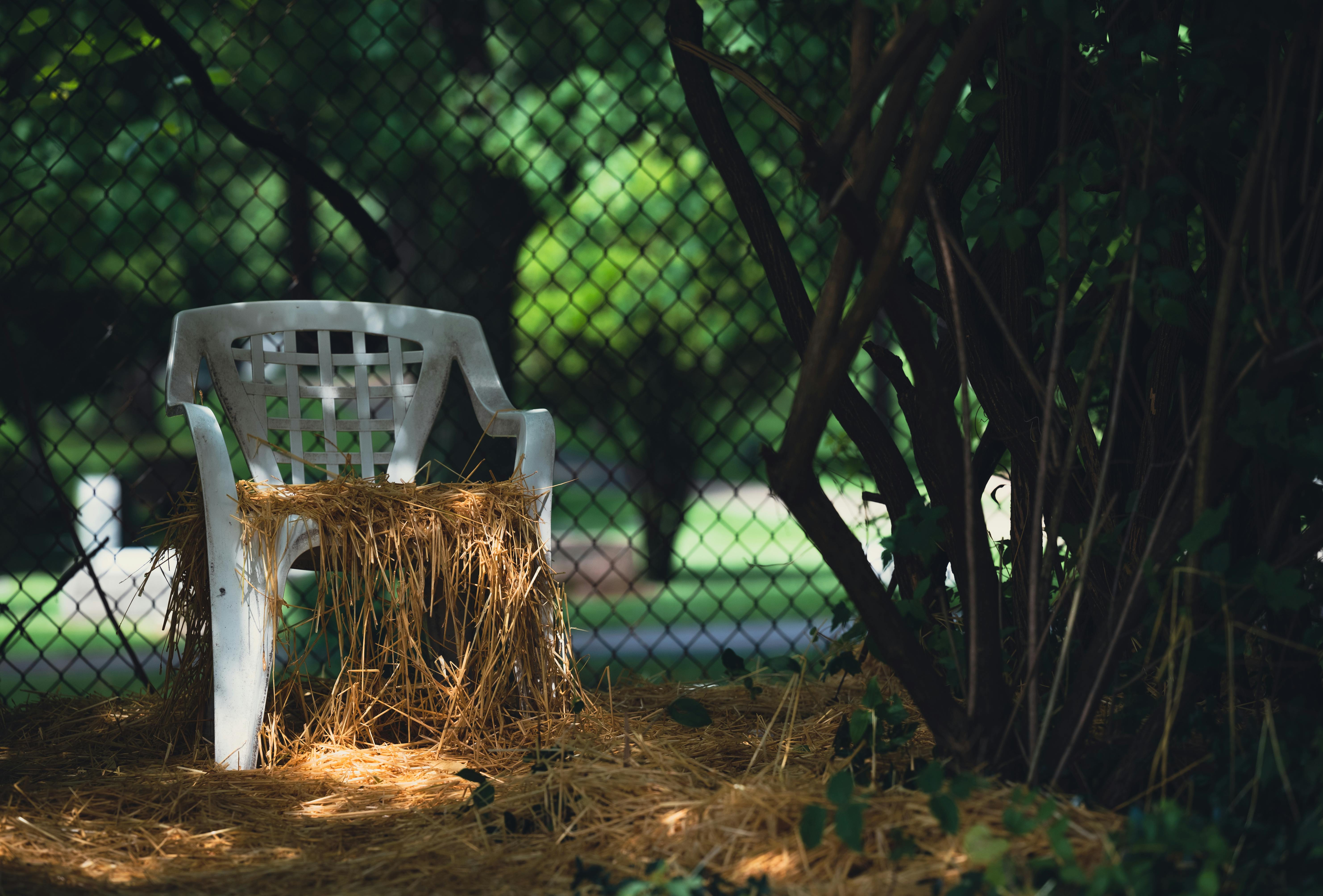 Hay on a Plastic Garden Chair · Free Stock Photo