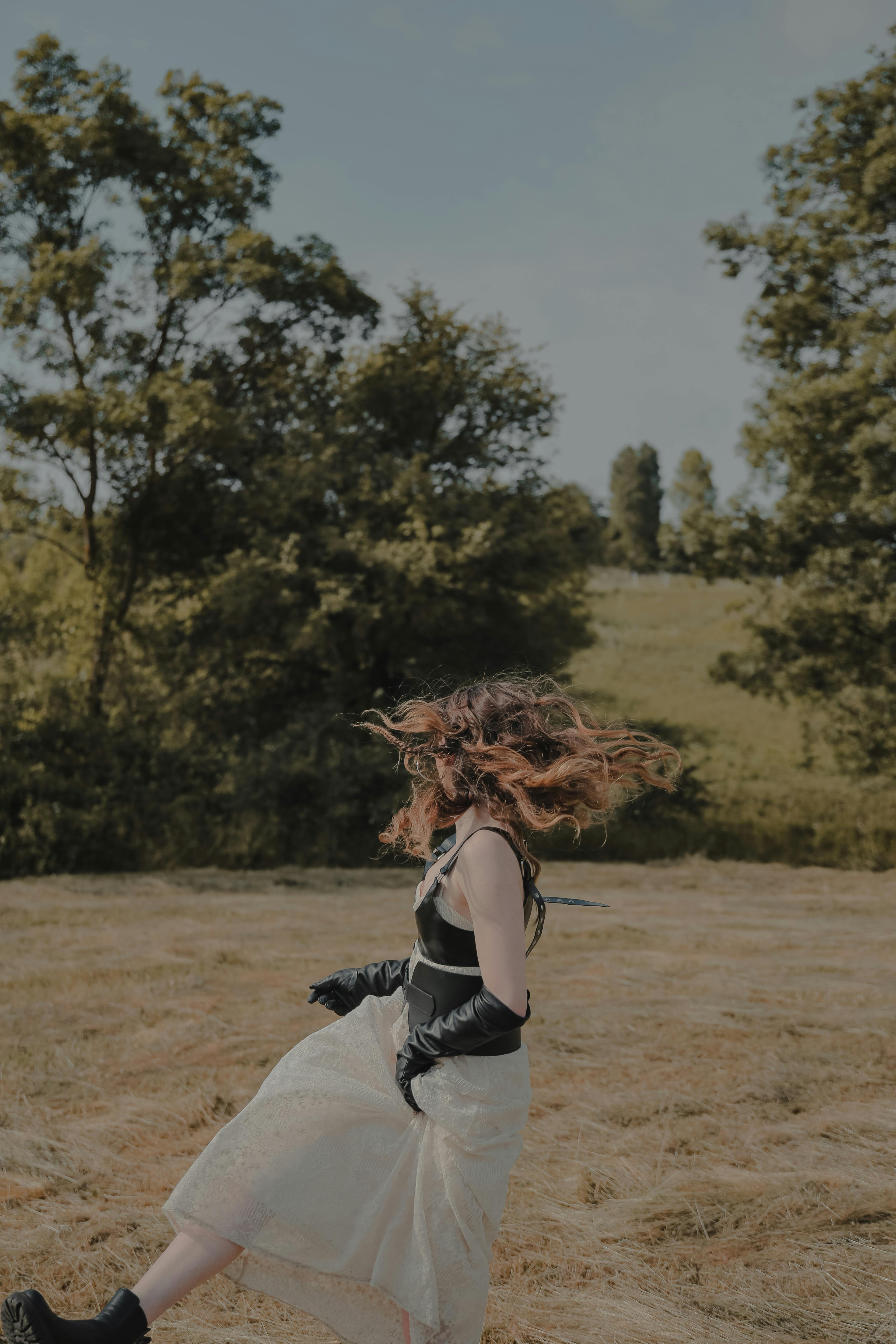 Woman Dancing in a Field · Free Stock Photo