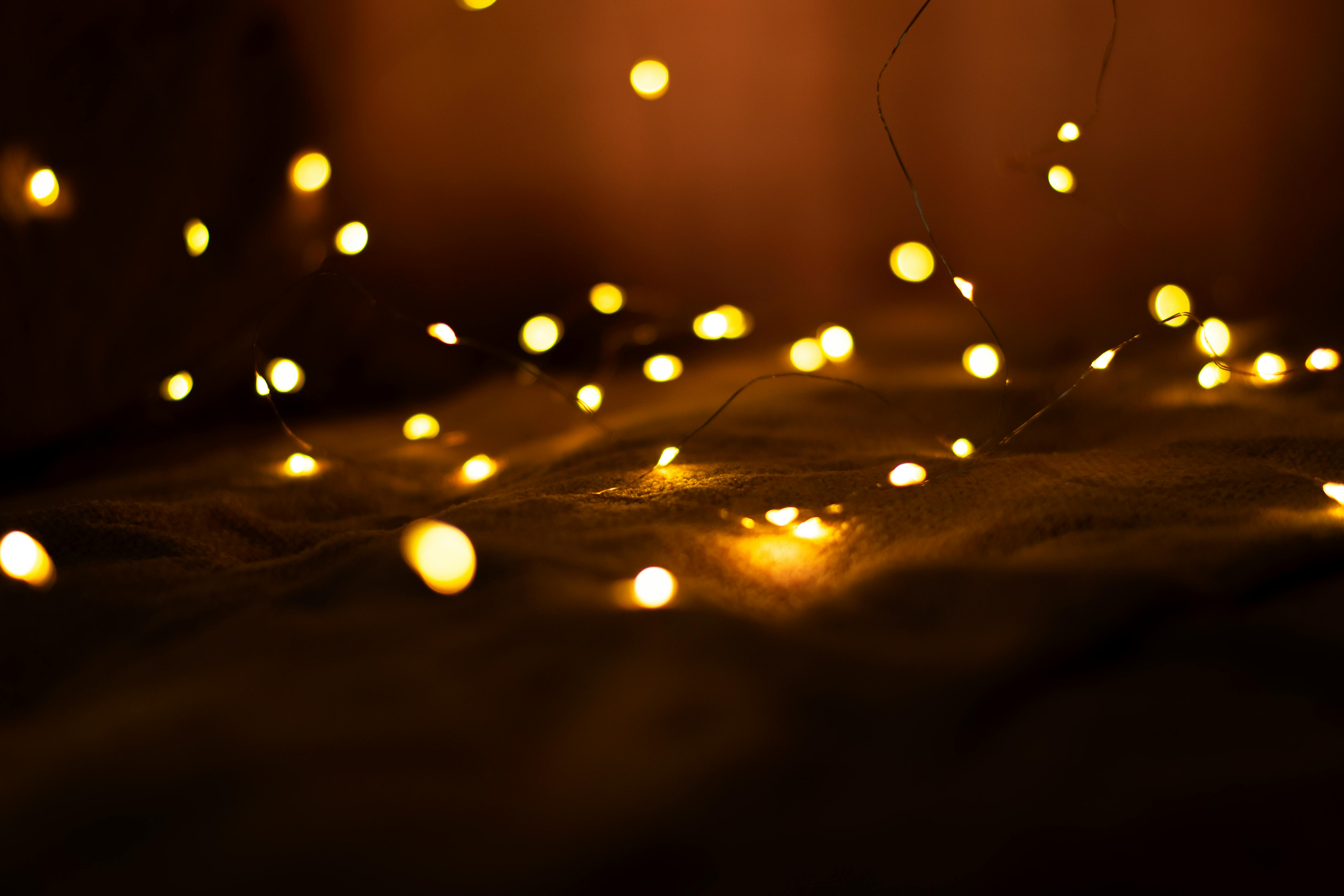 Yellow String Lights on Dark Room · Free Stock Photo
