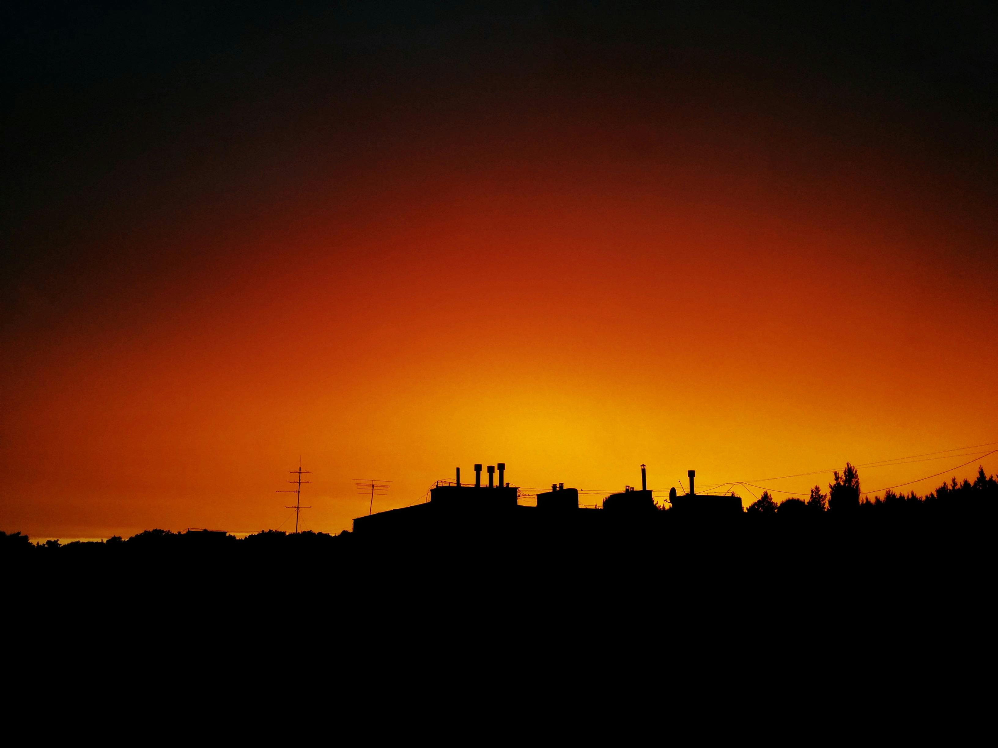 Silhouette of Buildings during Sunset · Free Stock Photo