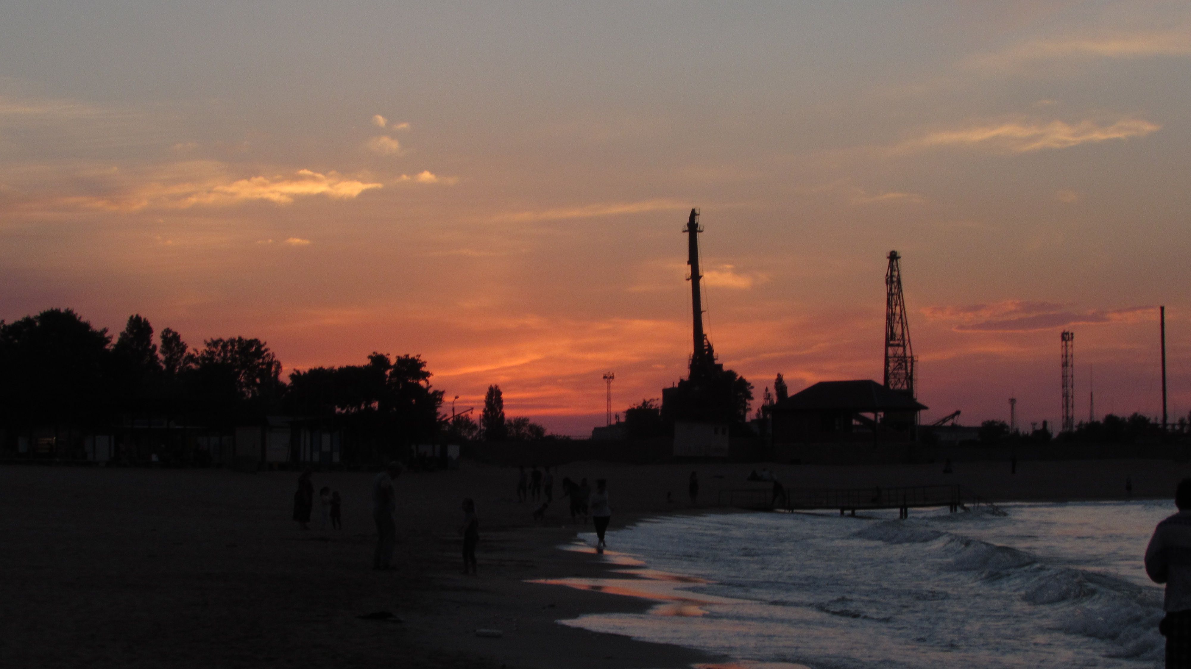 People Walking on the Beach during Sunset · Free Stock Photo