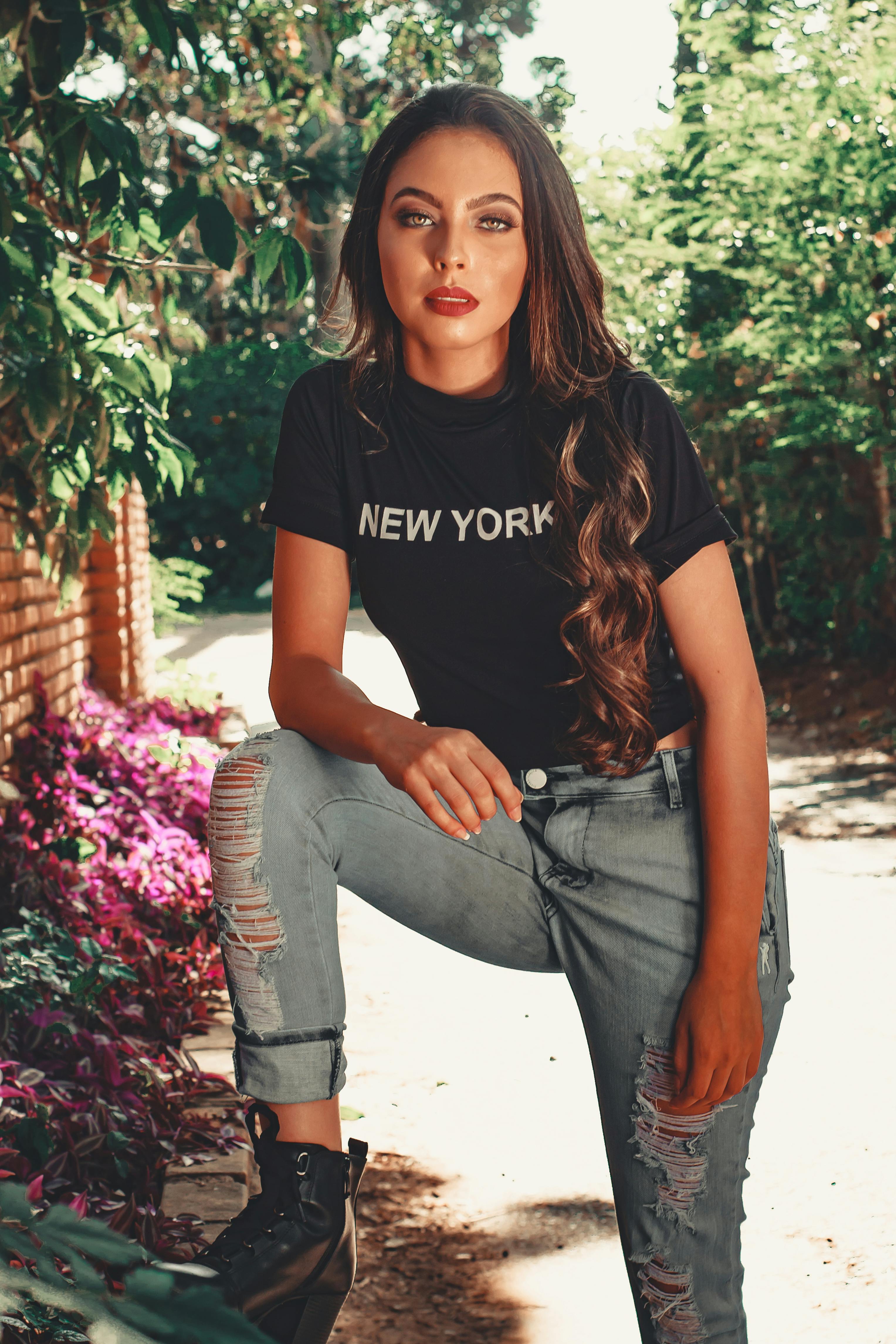 Person in Denim Jeans and Boots Sitting In Front of Campfire · Free ...