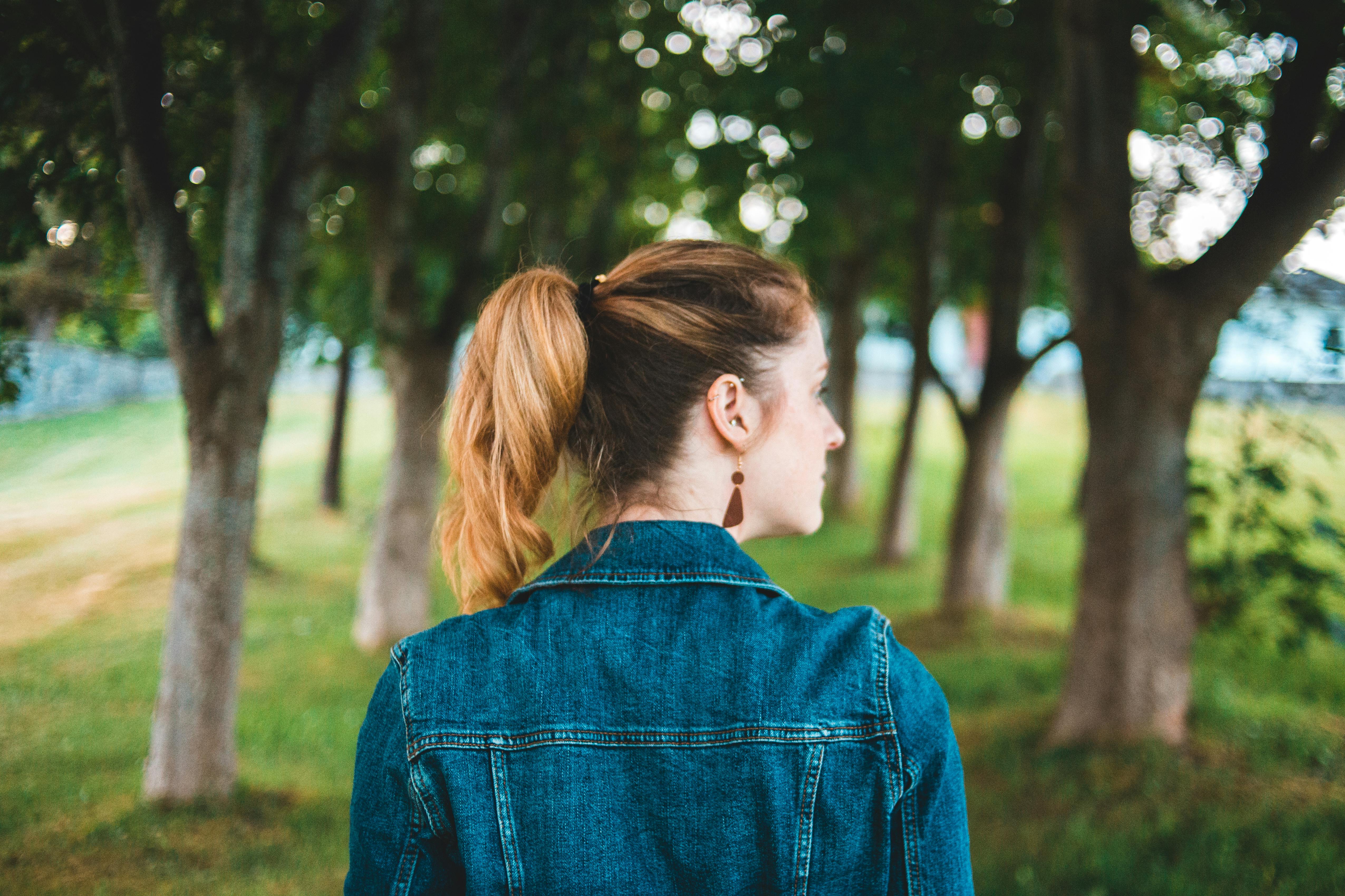 Back View of a Woman wearing a Denim Jacket · Free Stock Photo