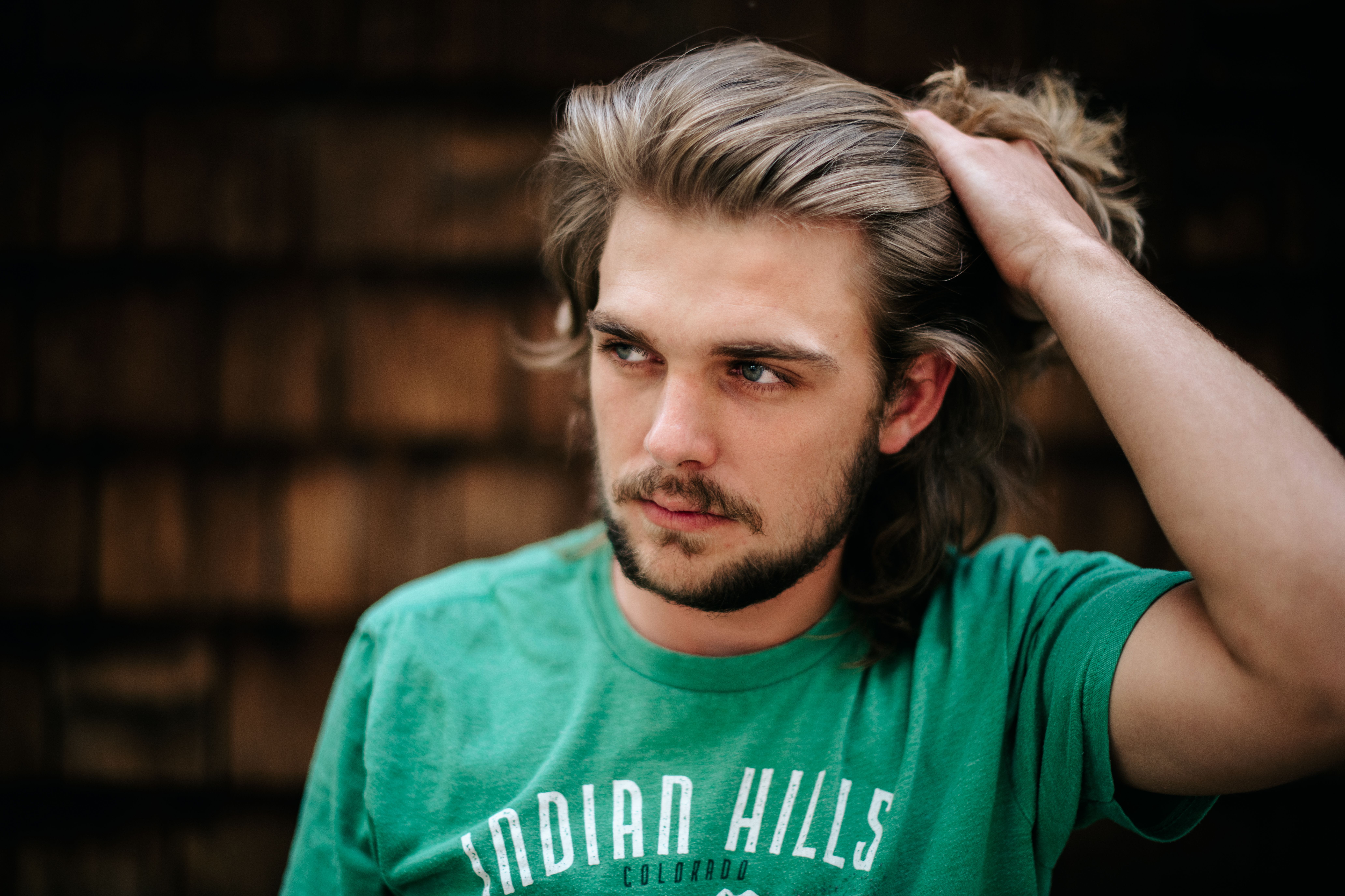 Man with Hand on Hair · Free Stock Photo