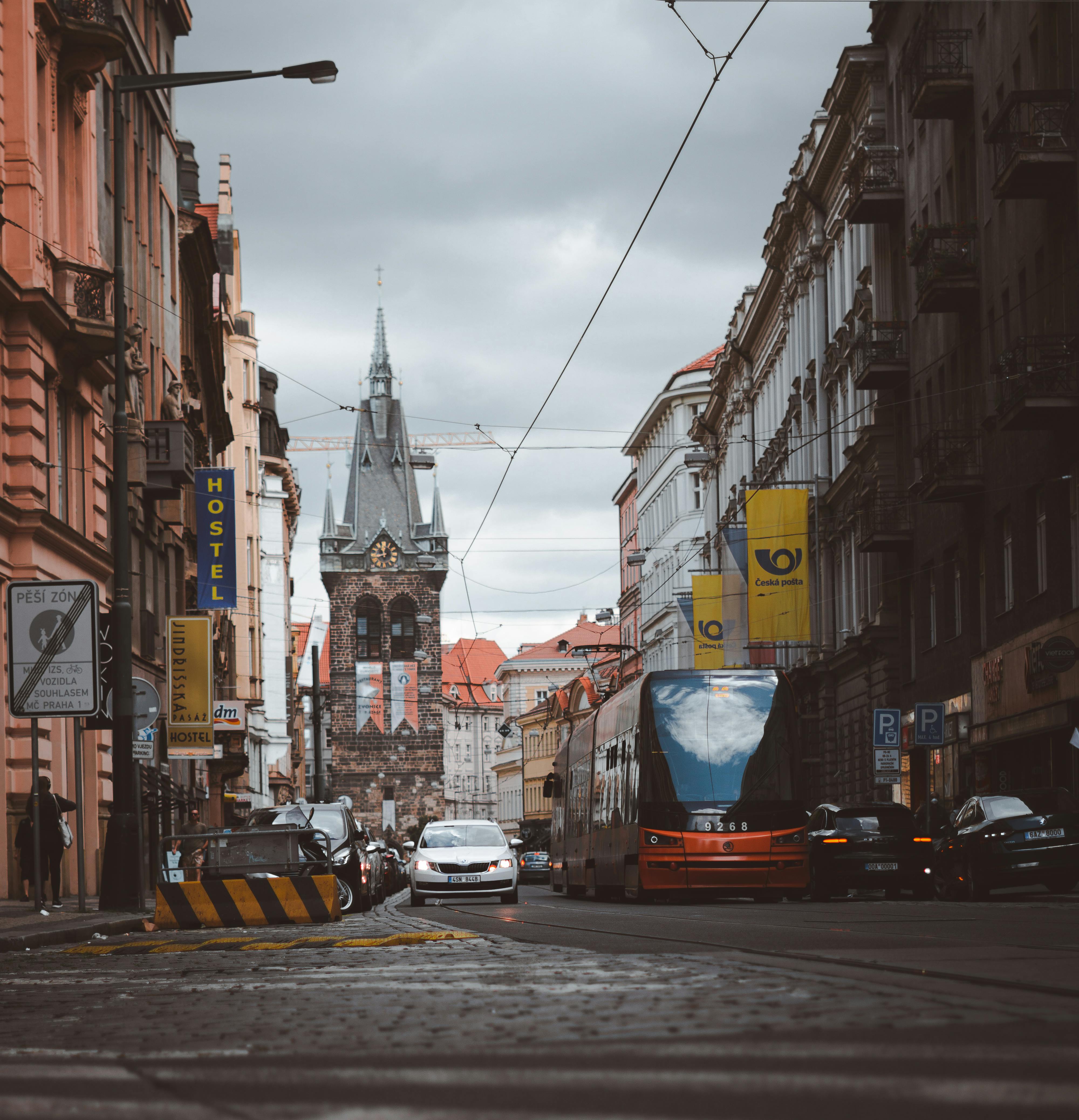 Low Angle Shot of City Street with Traffic and Clock Tower in ...