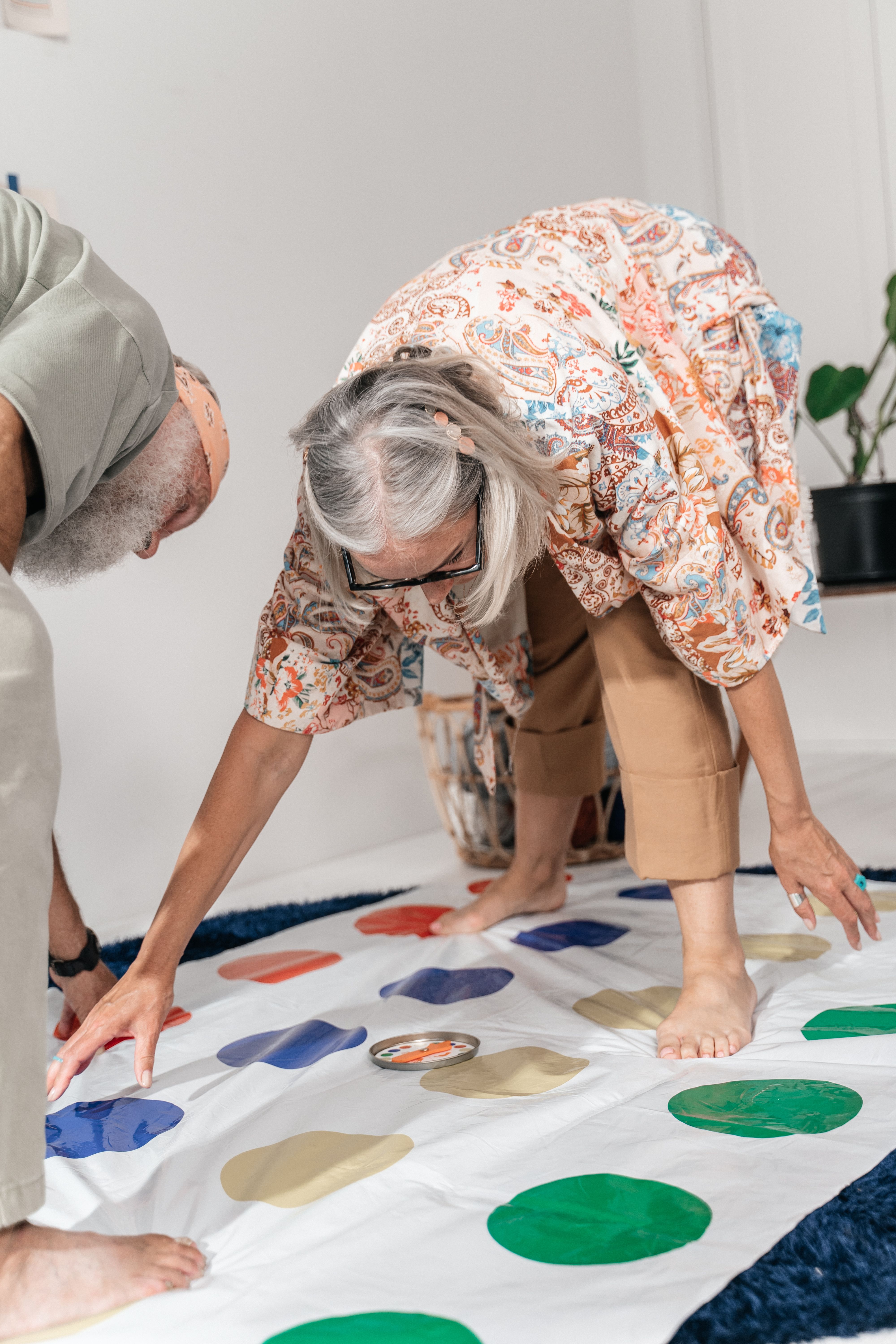 Active Elderly Couple Playing Twister Game · Free Stock Photo
