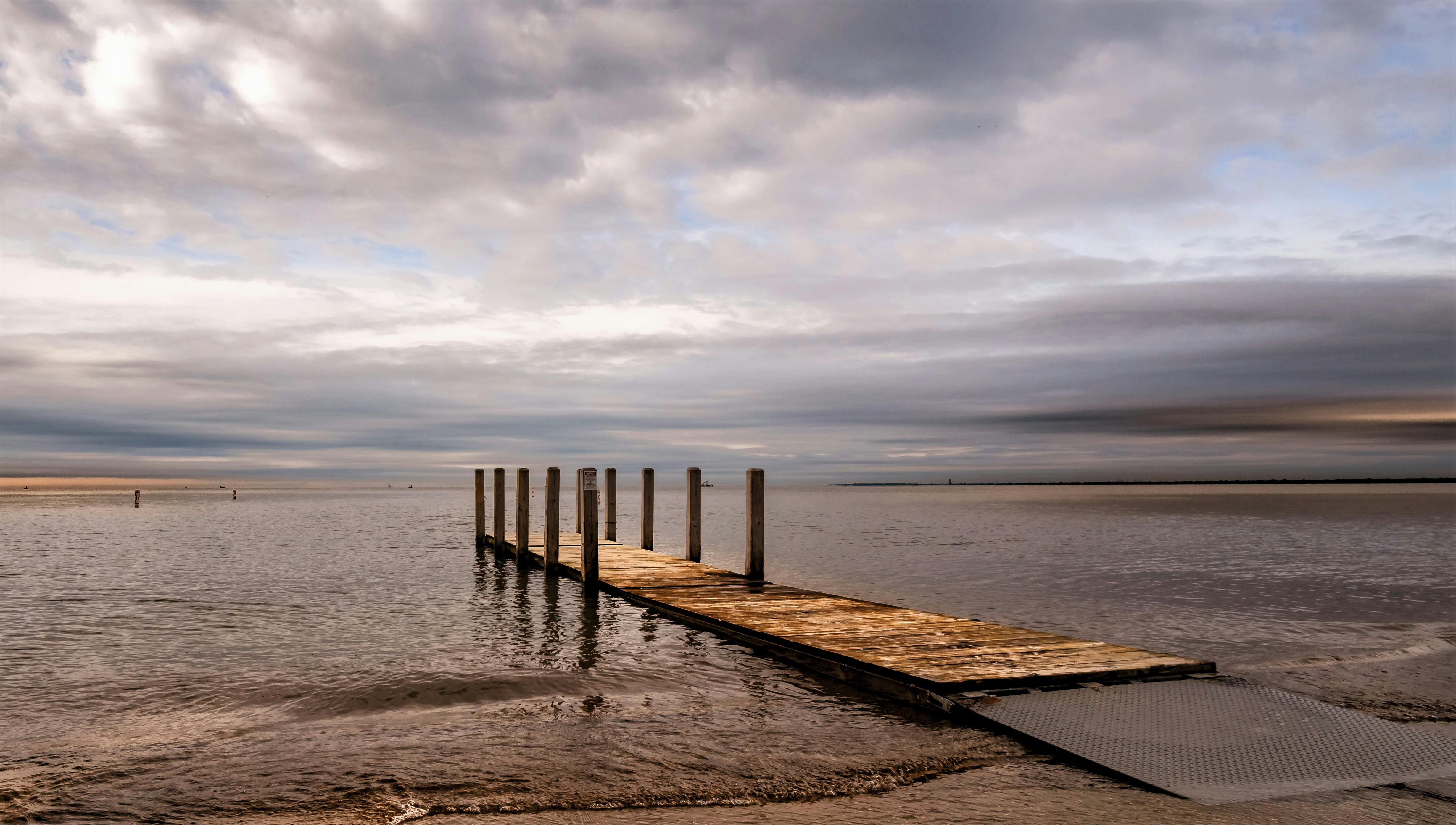 Brown Wooden Dock on Body of Water · Free Stock Photo