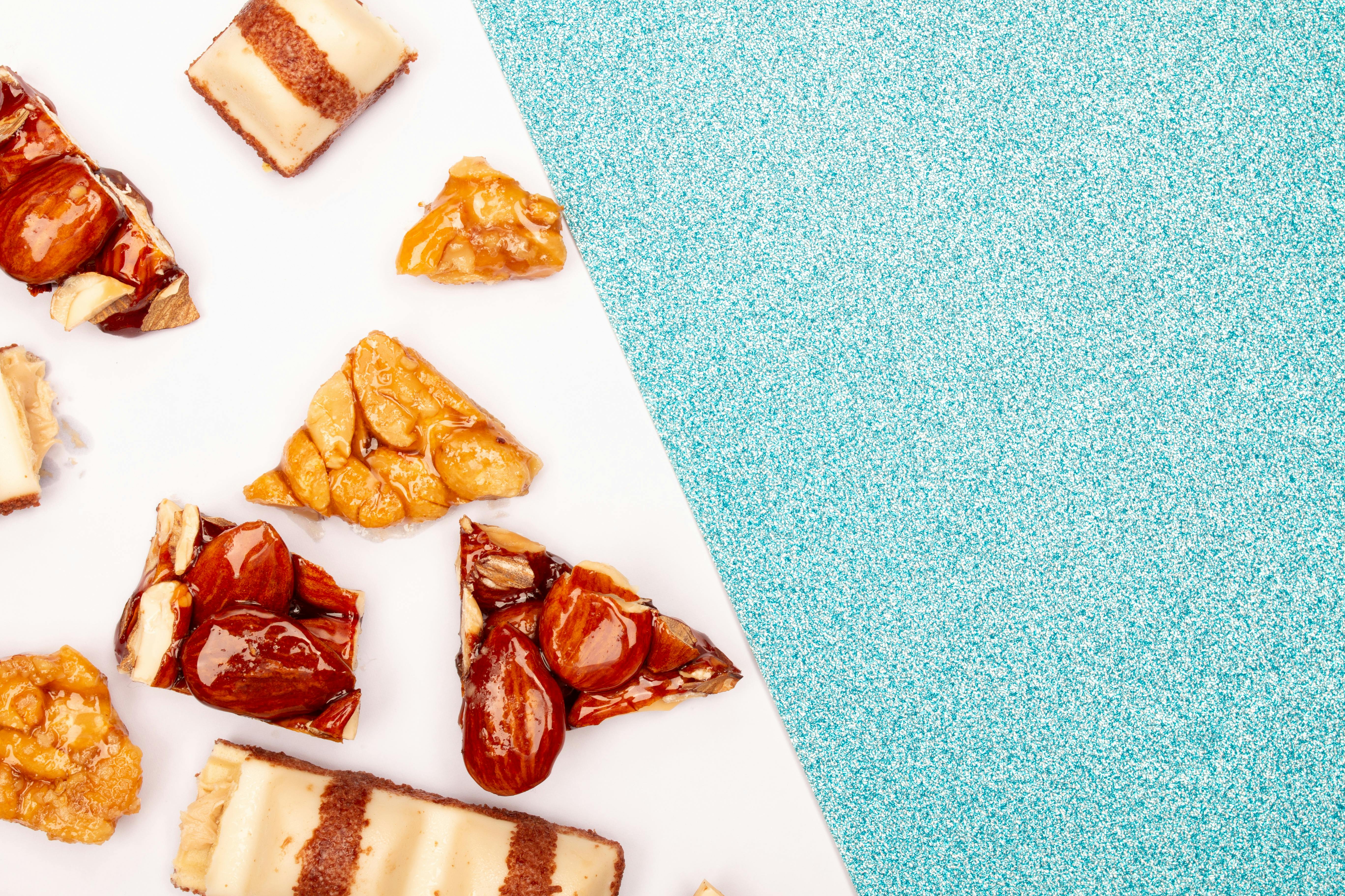 Caramel Coated Nuts on White Surface · Free Stock Photo