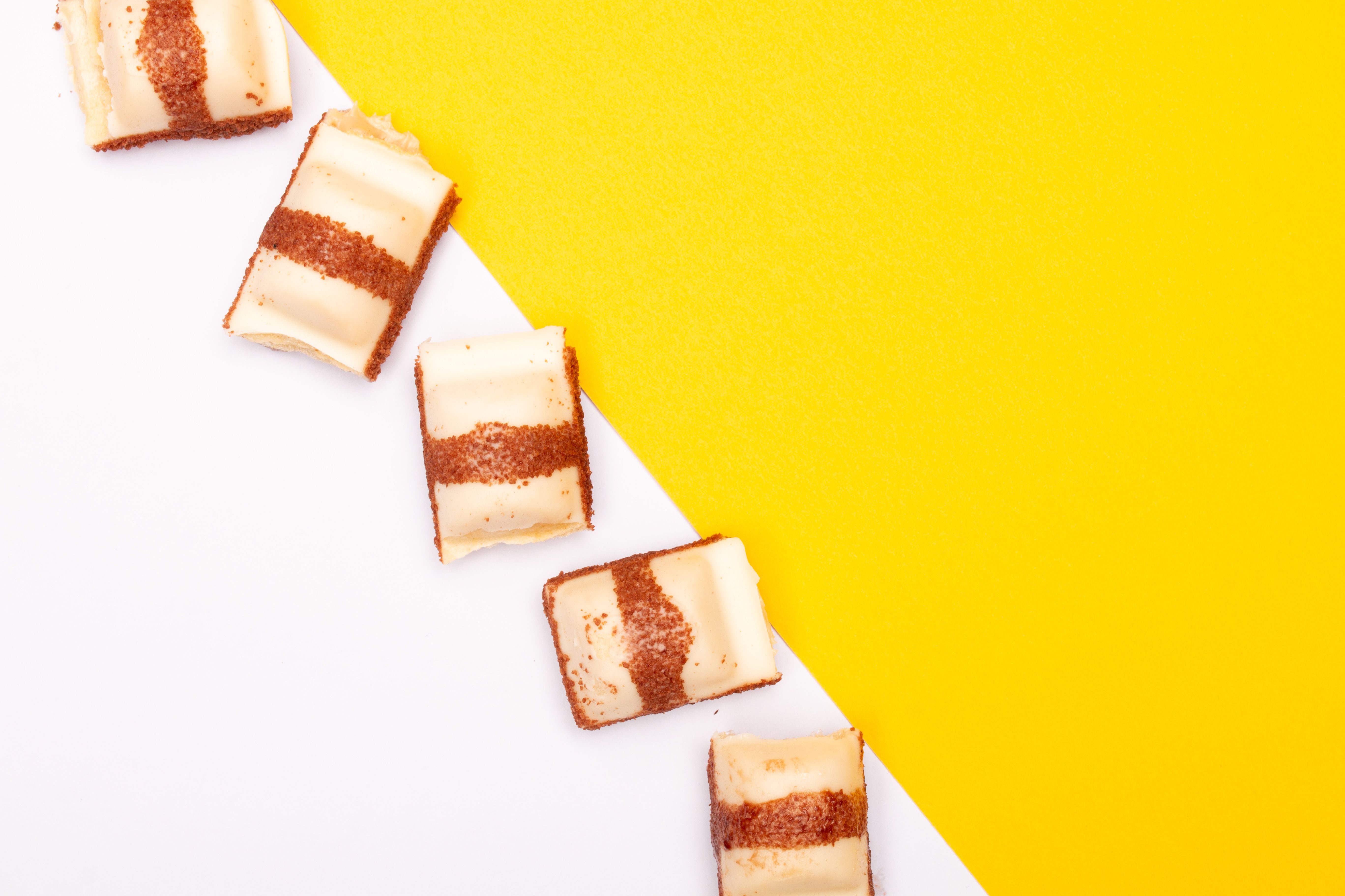 Snack Bars on White and Yellow Surface · Free Stock Photo