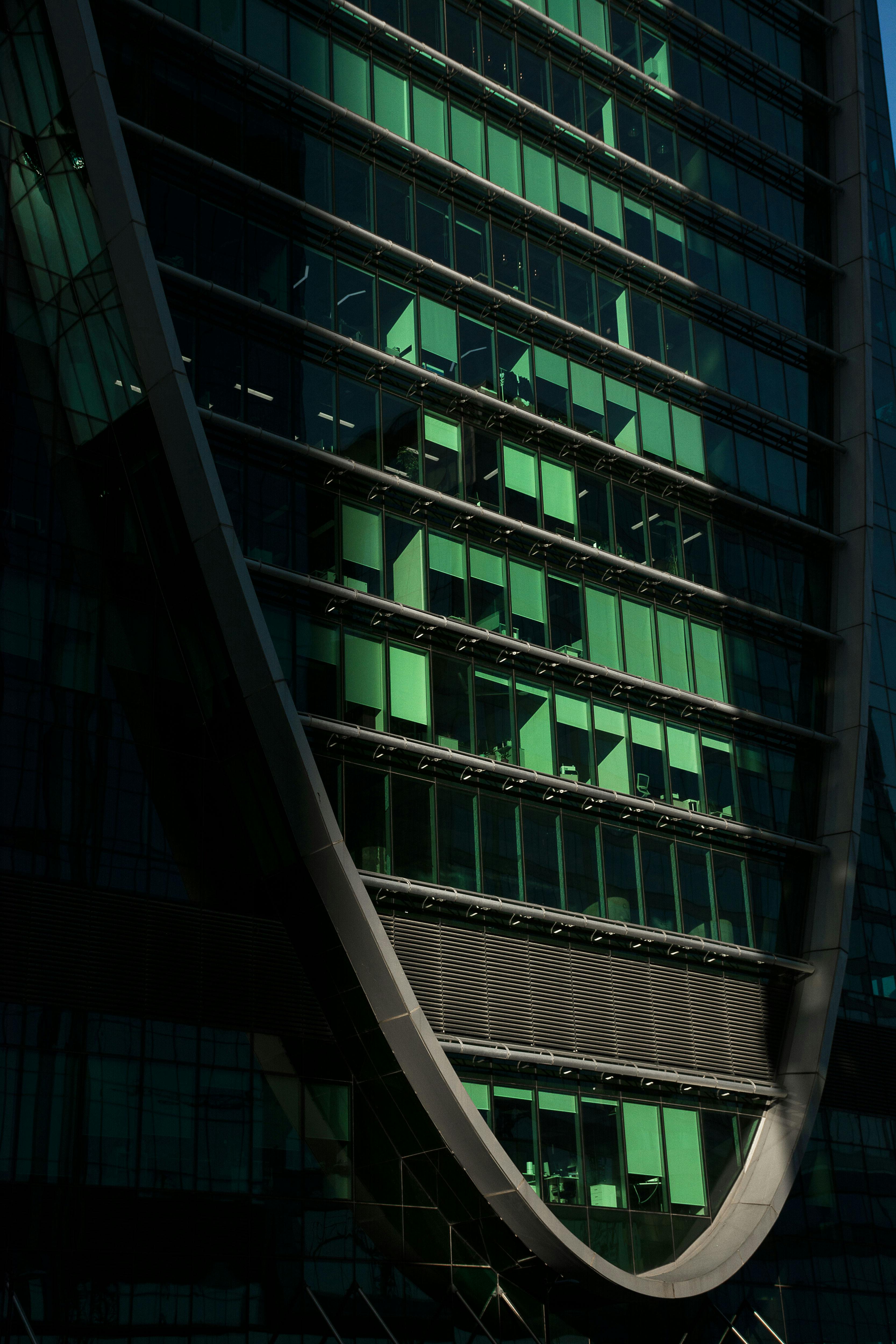 Grey Concrete Round High Rise Building · Free Stock Photo