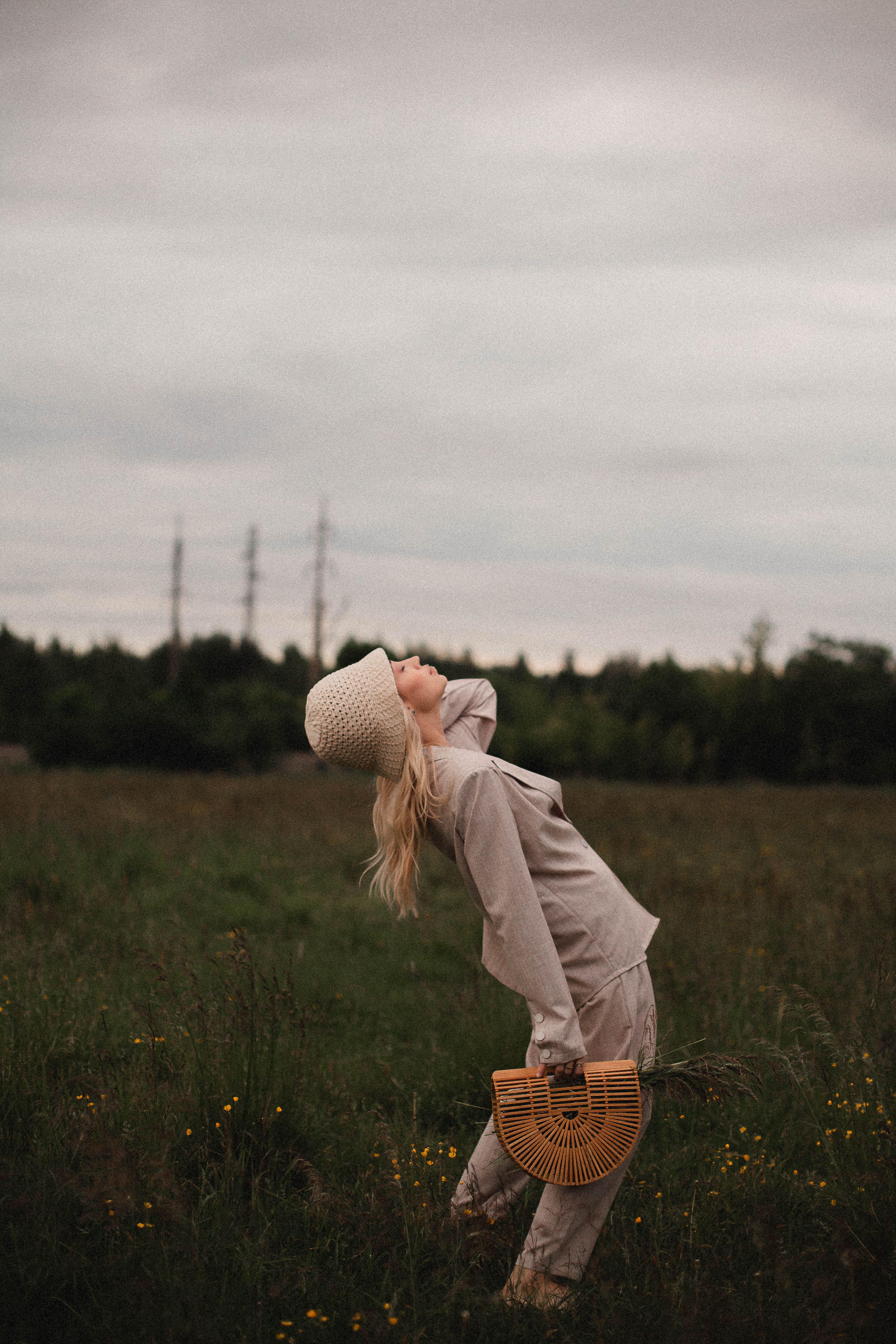 Woman with a Hat Leaning · Free Stock Photo
