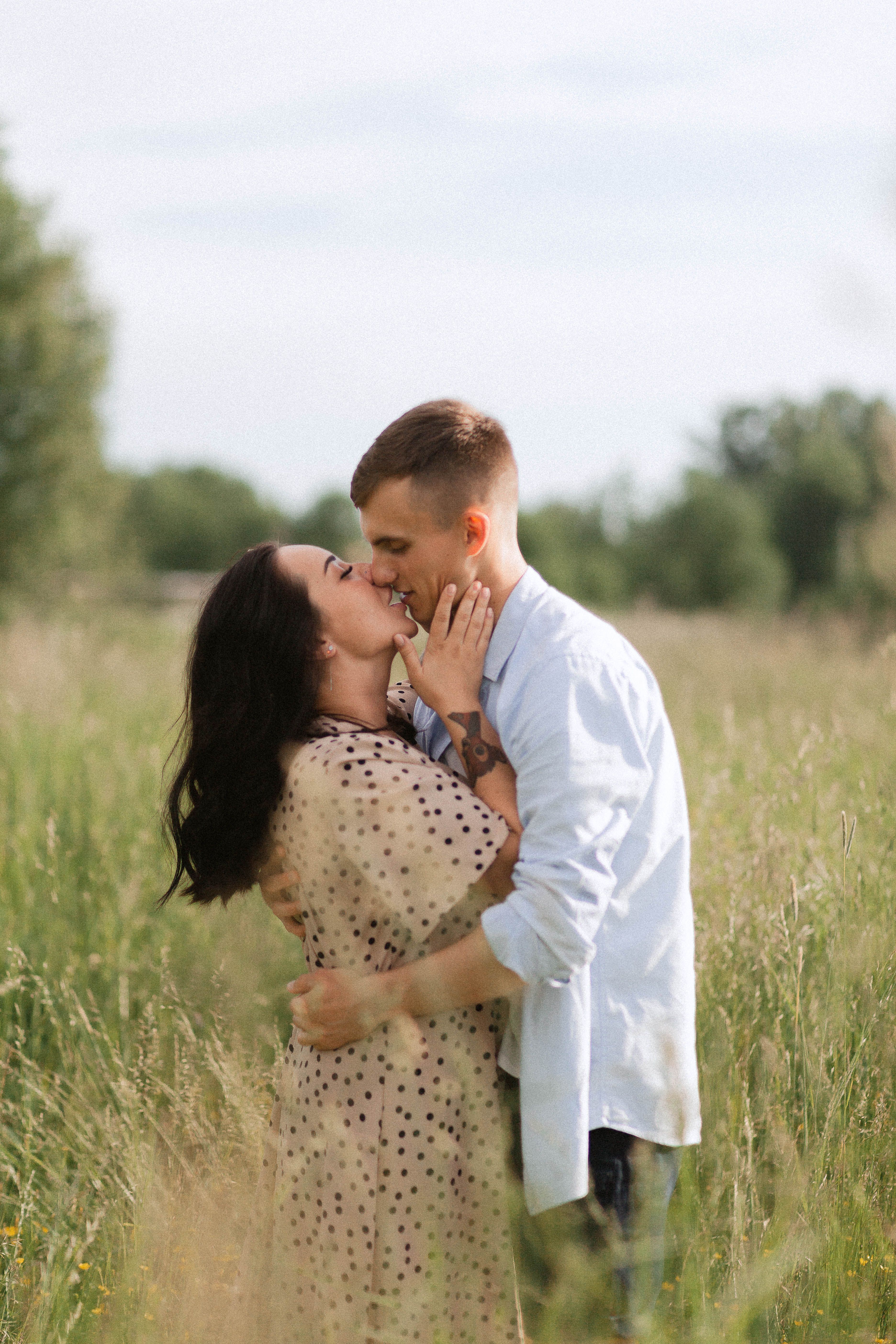Affectionate Couple giving each other a Kiss · Free Stock Photo