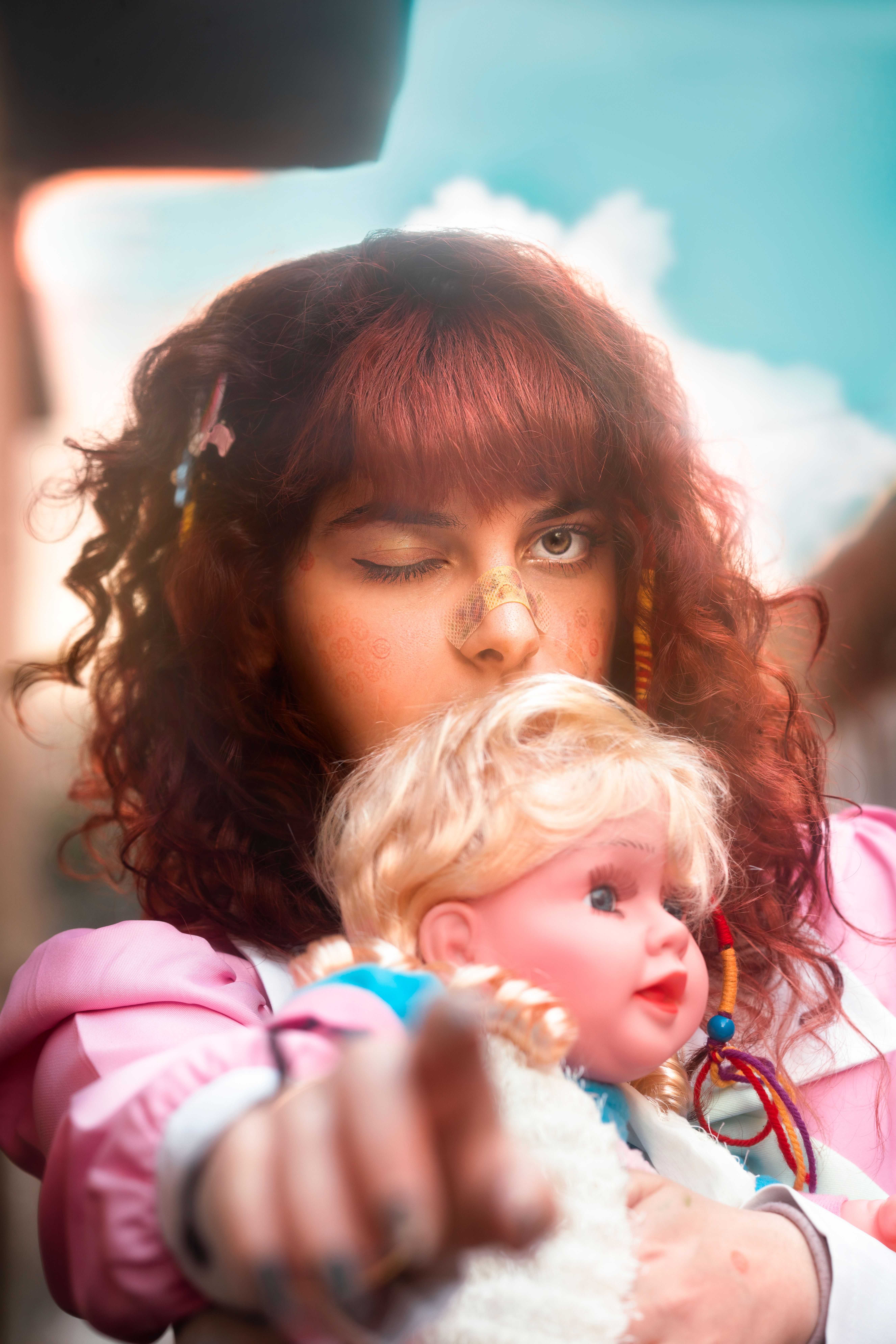 Blinking Eye Girl Holding Doll · Free Stock Photo