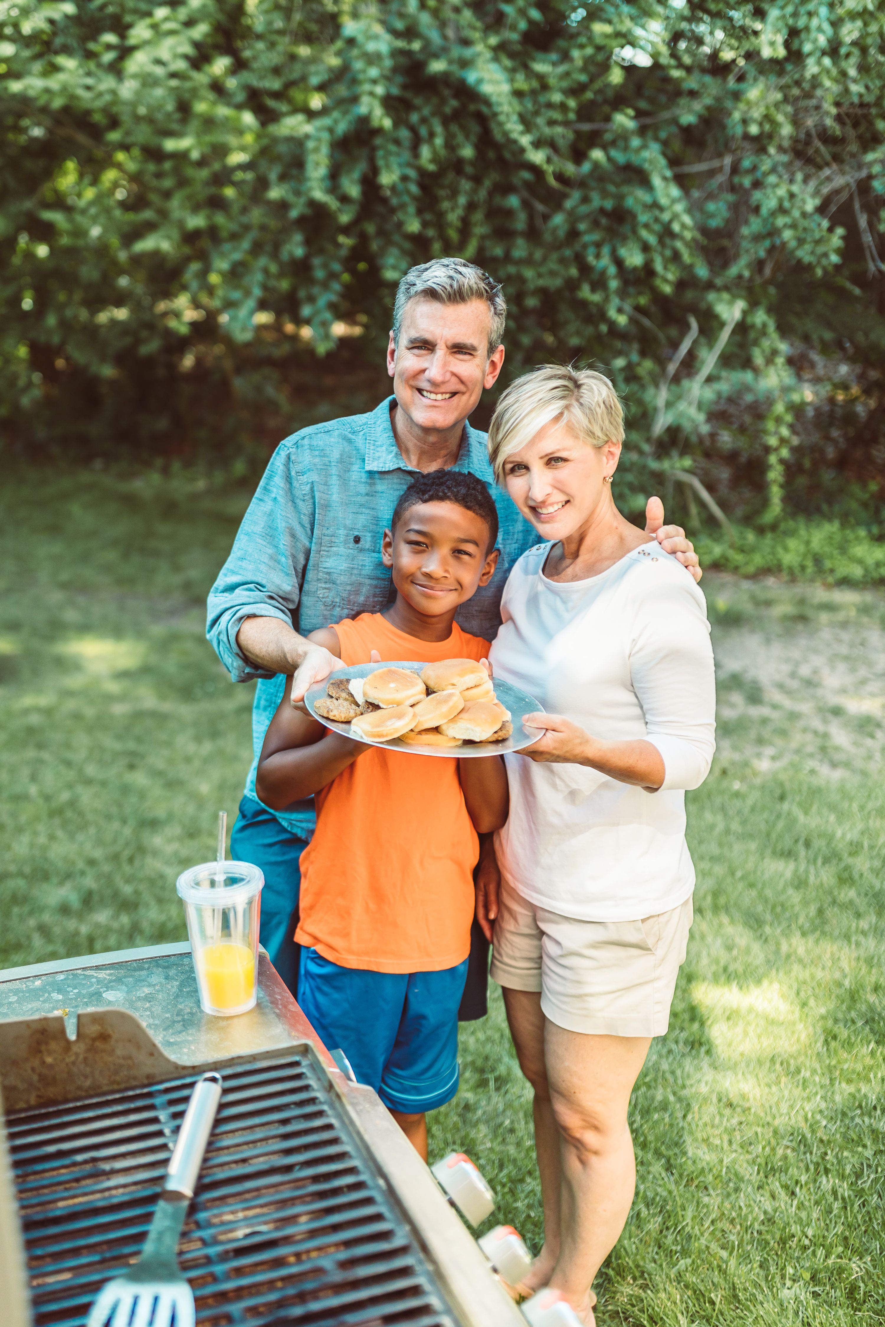 A Family Holding A Sign With Quote · Free Stock Photo
