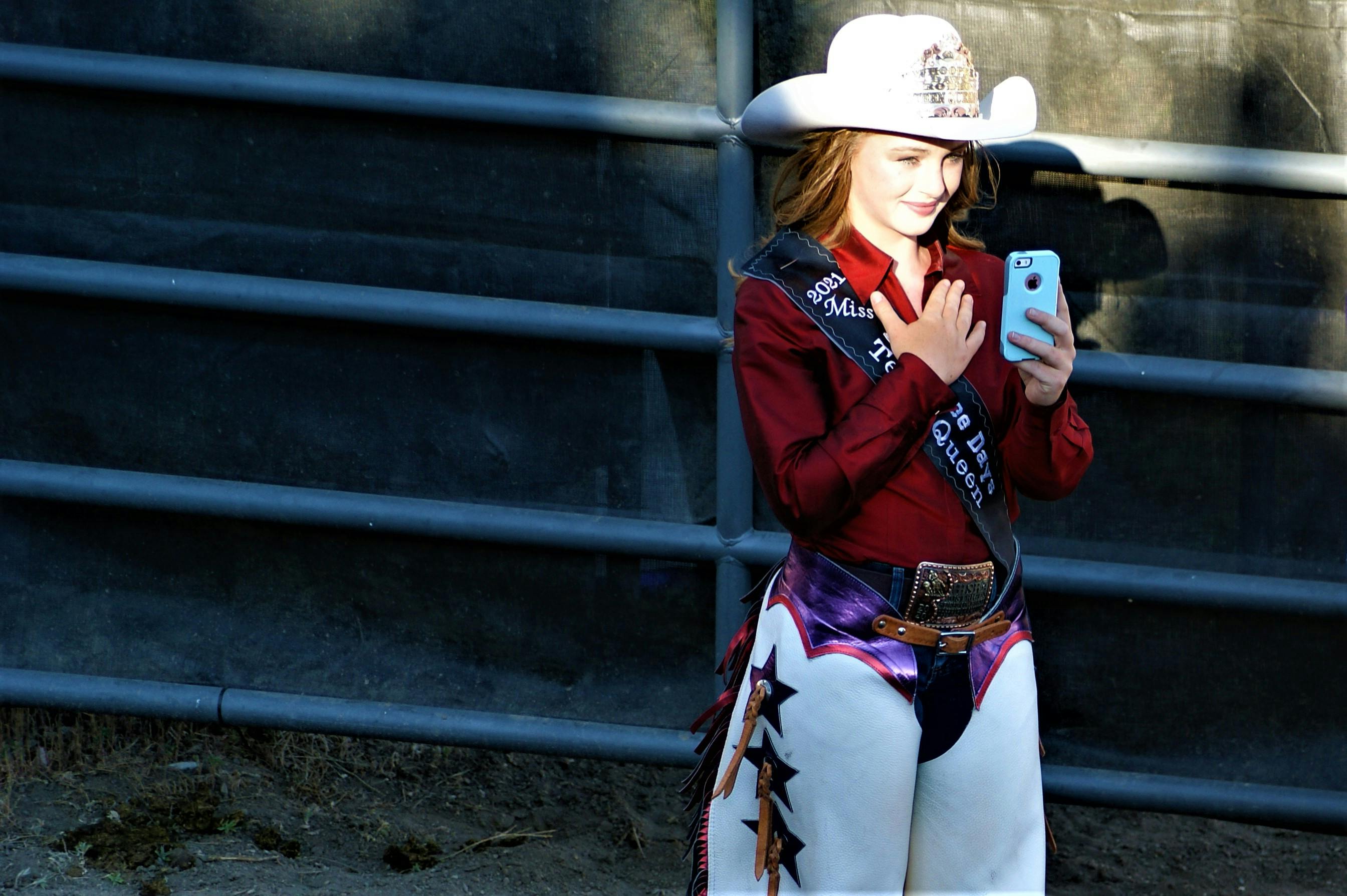 Model in Cowboy Attire Taking Photo · Free Stock Photo