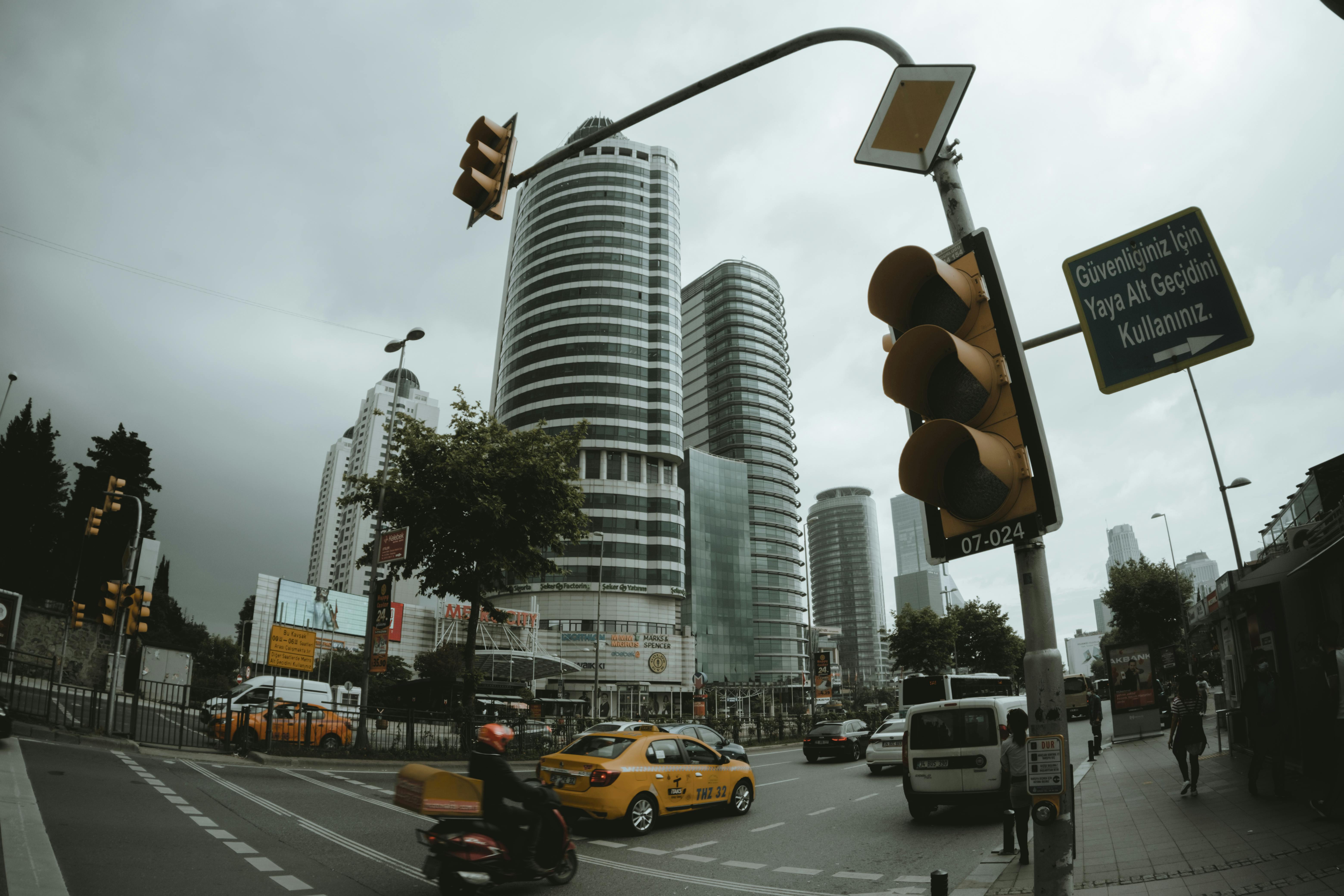 Cars on the Road Near High Rise Buildings · Free Stock Photo