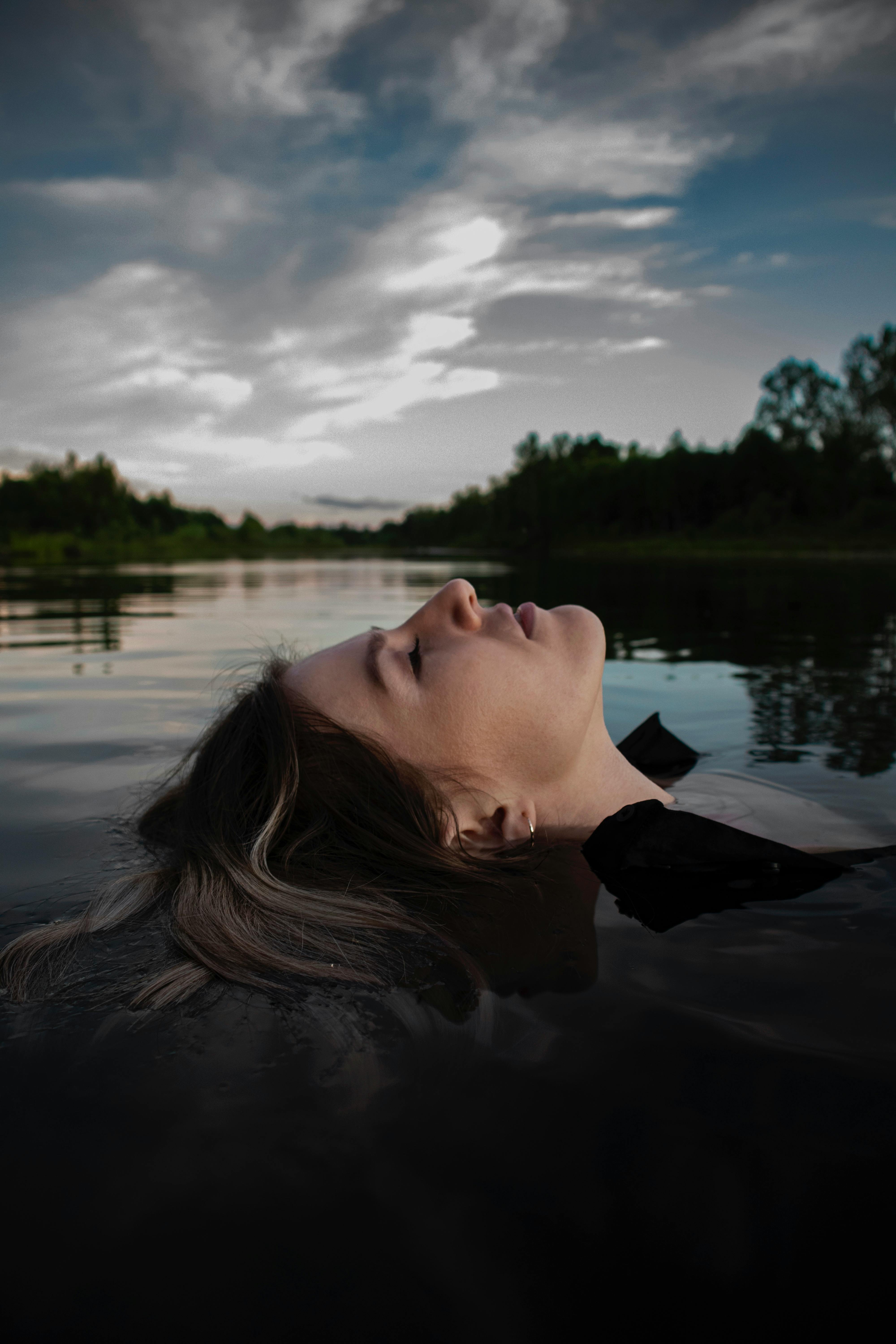 Woman Lying in Water · Free Stock Photo