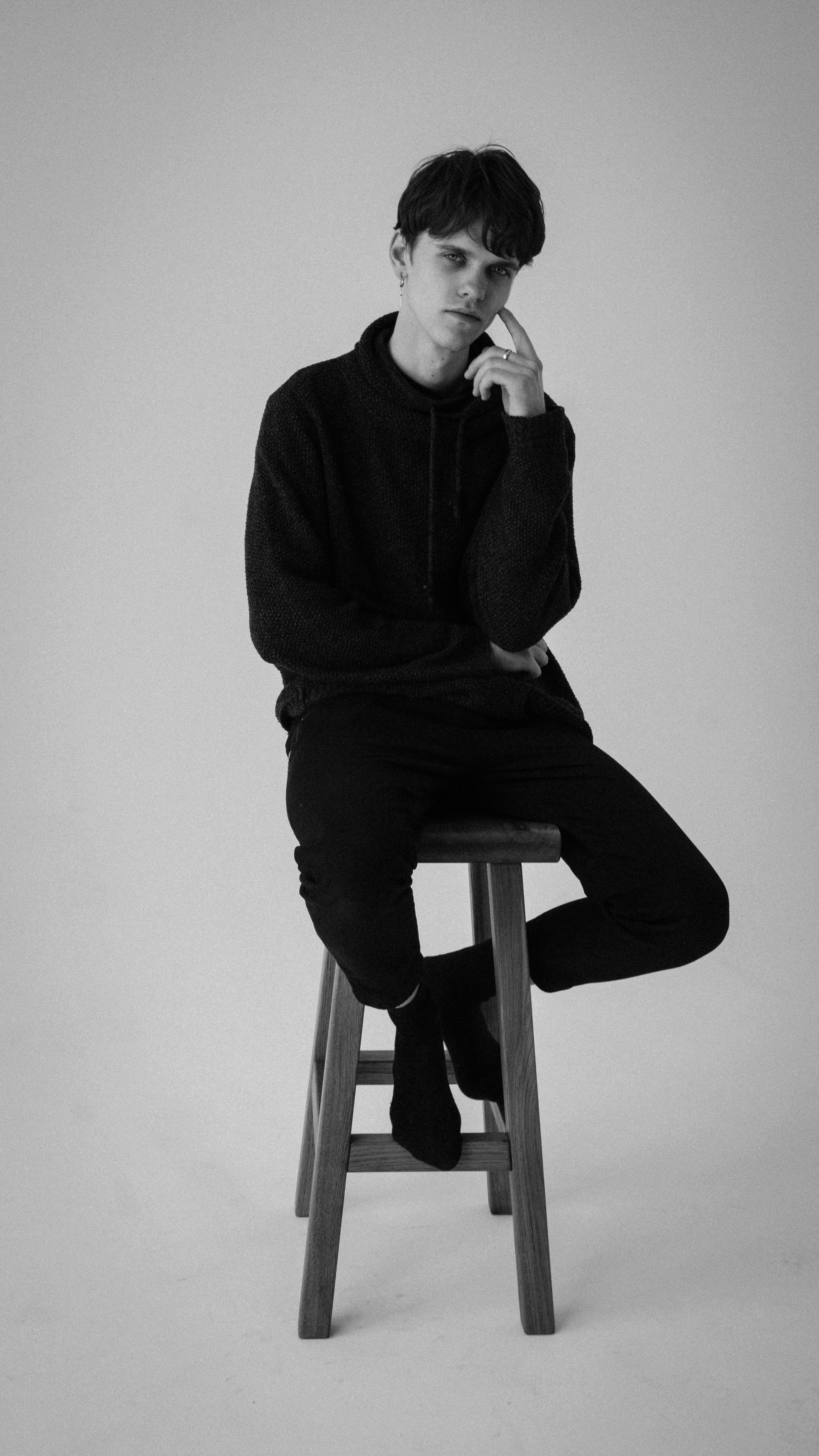 Man Sitting on Unstable Chair · Free Stock Photo