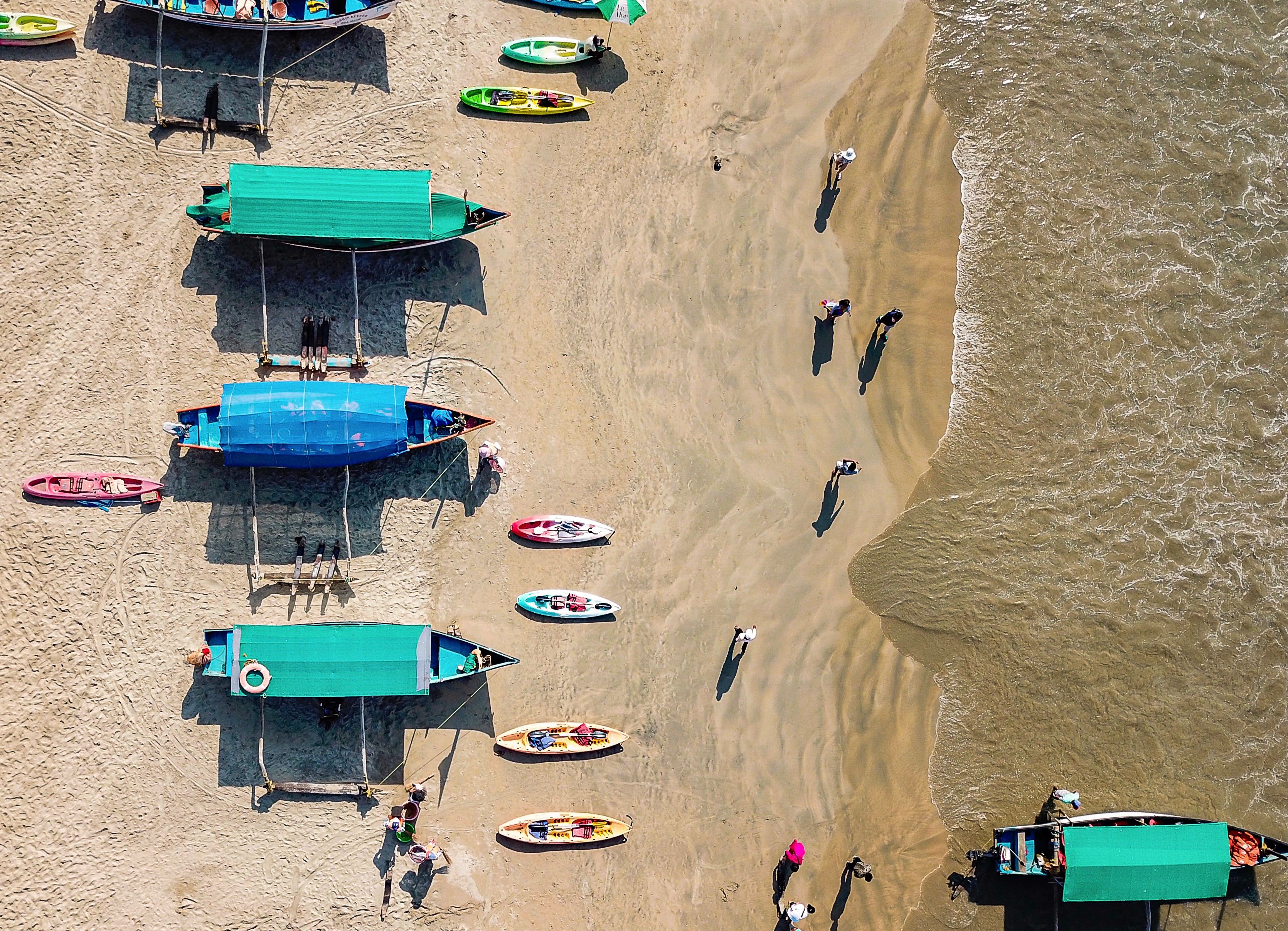 Aerial View of Boats and Kayaks on Shore · Free Stock Photo
