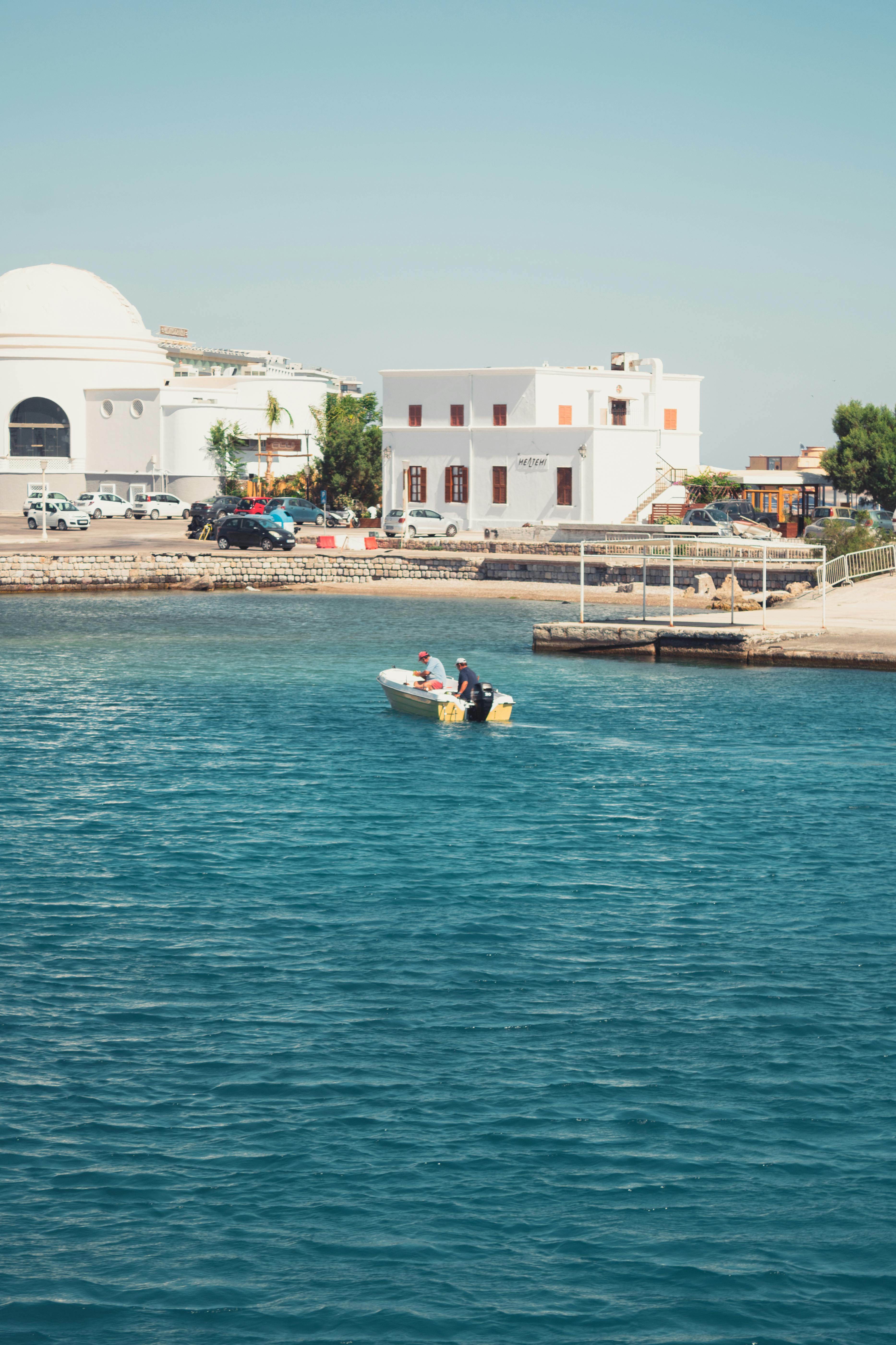 Two People Riding on a Motorboat · Free Stock Photo