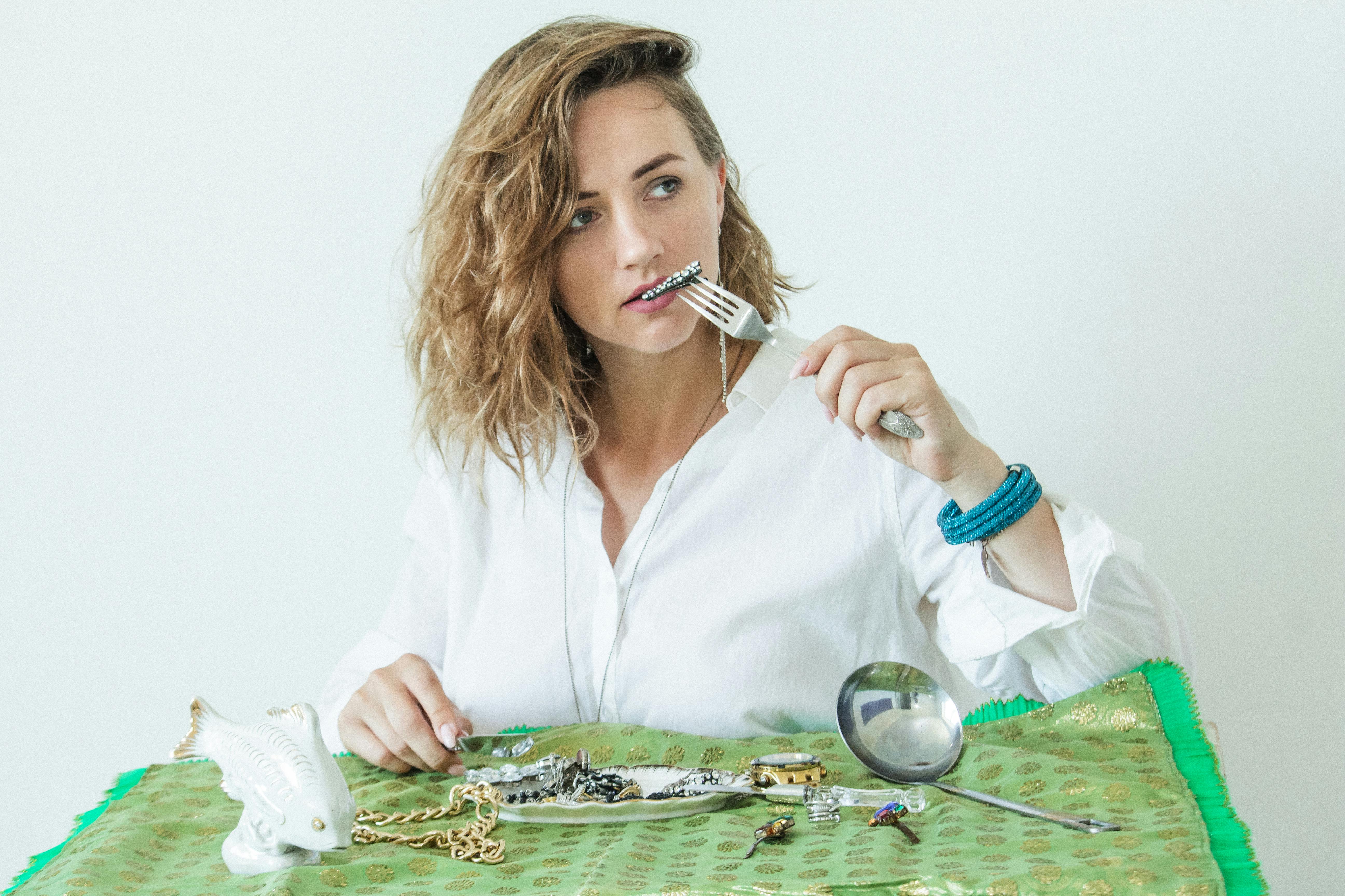 Woman Eating Metal · Free Stock Photo