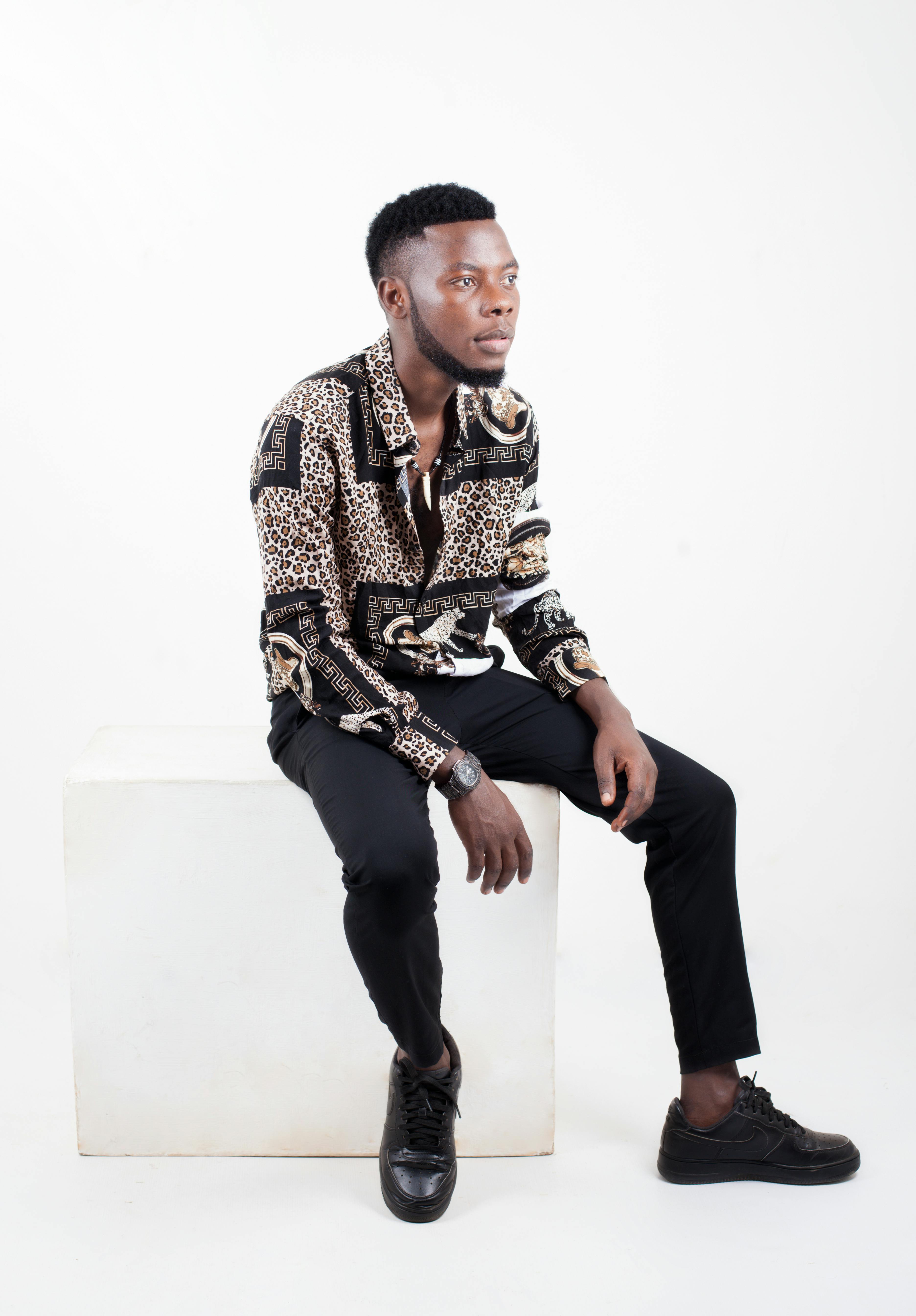 Photo of a Handsome Man Wearing a Polo with Animal Print · Free Stock Photo