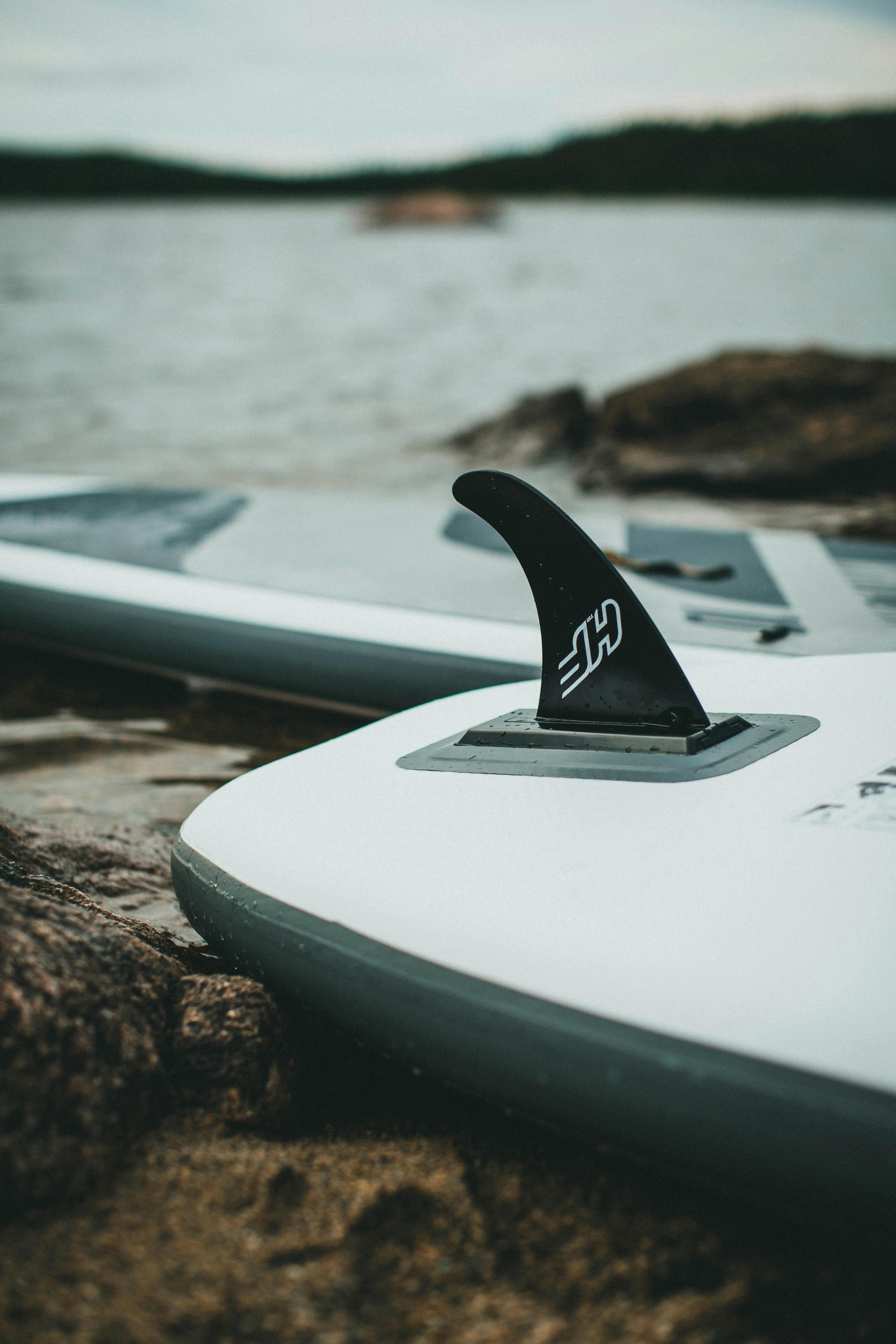 Surfboard with Fin Near Grass · Free Stock Photo