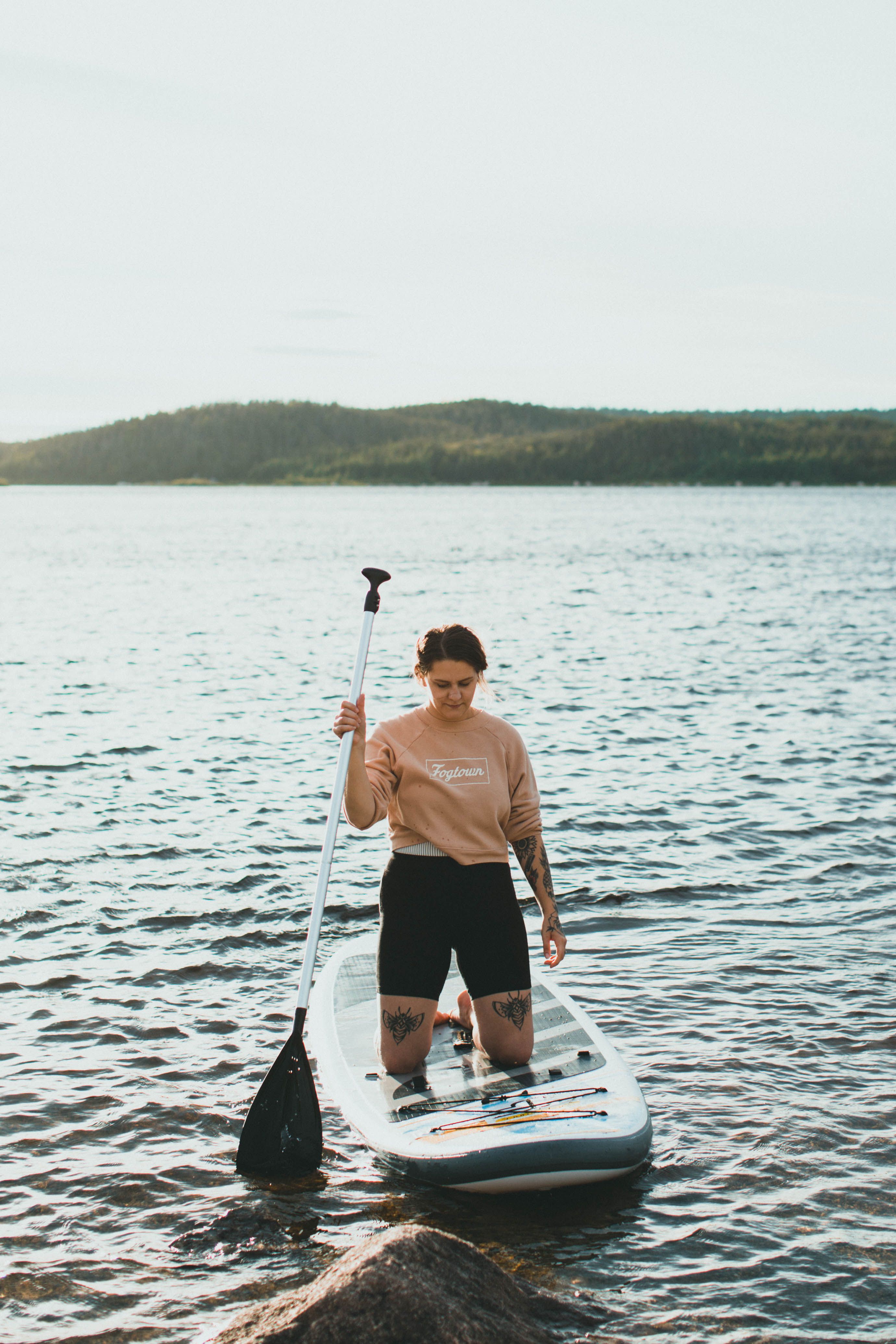 Aerial View of a Woman Paddling on Her Sap Board · Free Stock Photo
