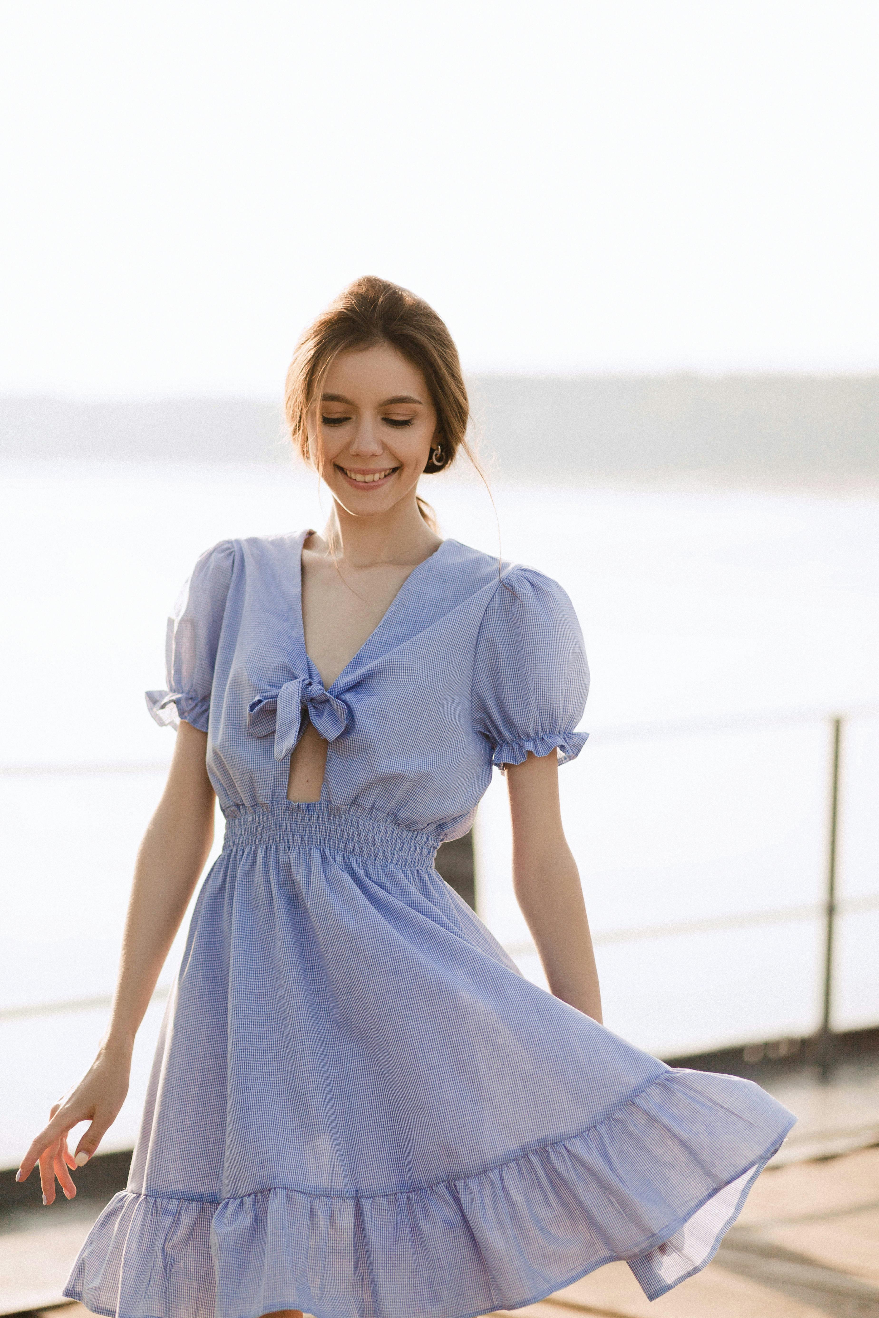 A Pretty Woman in Blue Dress Standing · Free Stock Photo