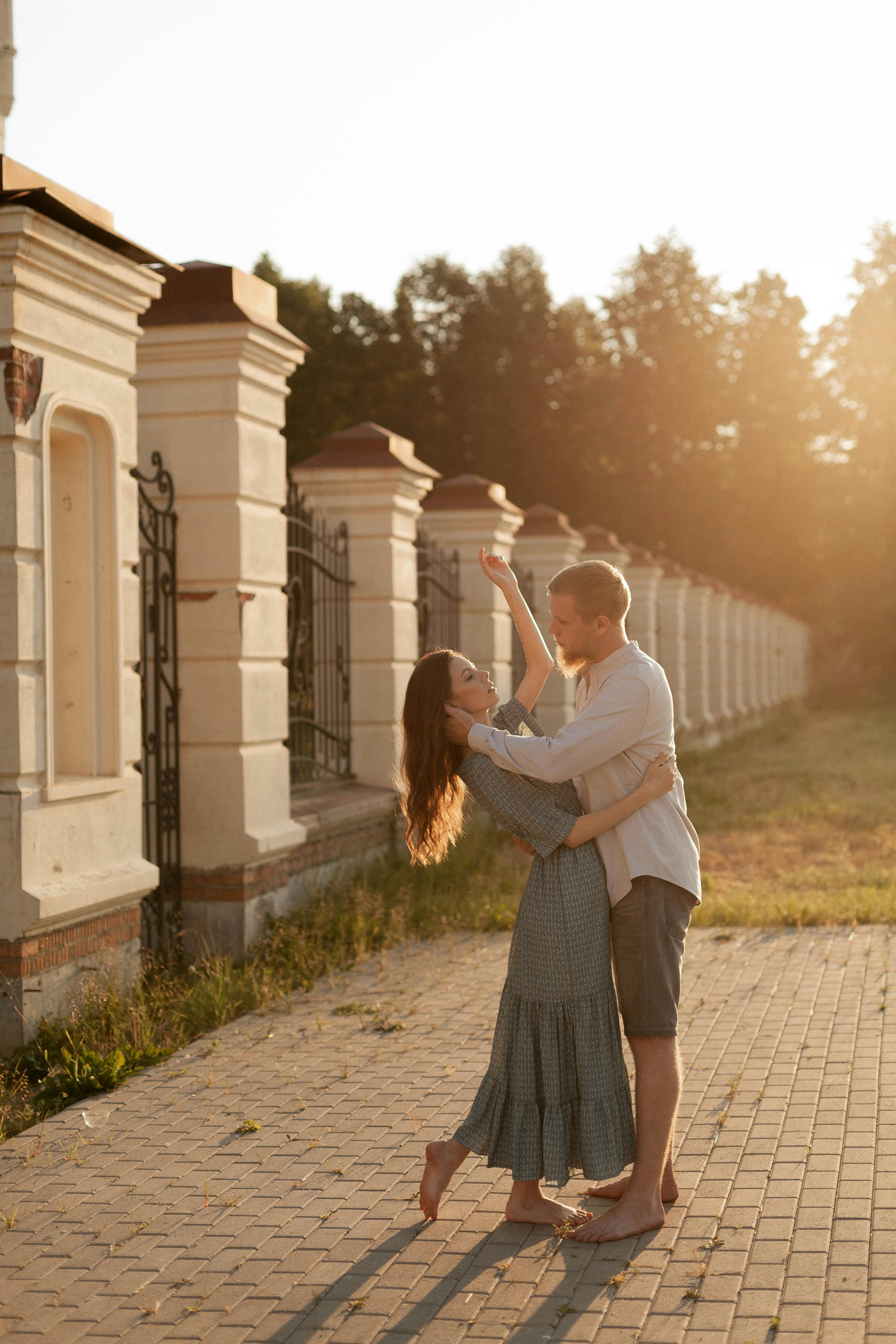 Man Hugging Woman while Holding Umbrella · Free Stock Photo