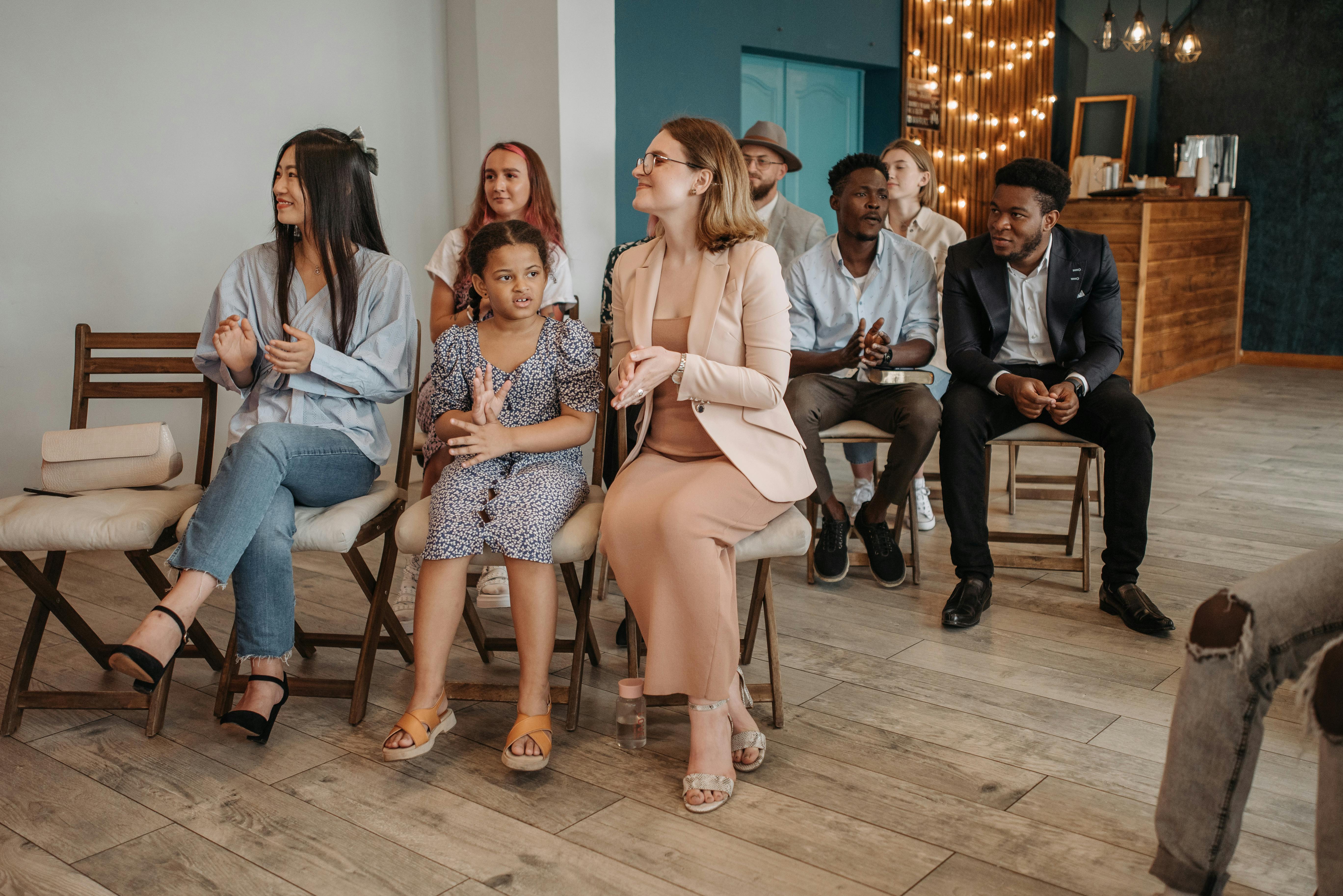 Sitting People Clapping Hands · Free Stock Photo